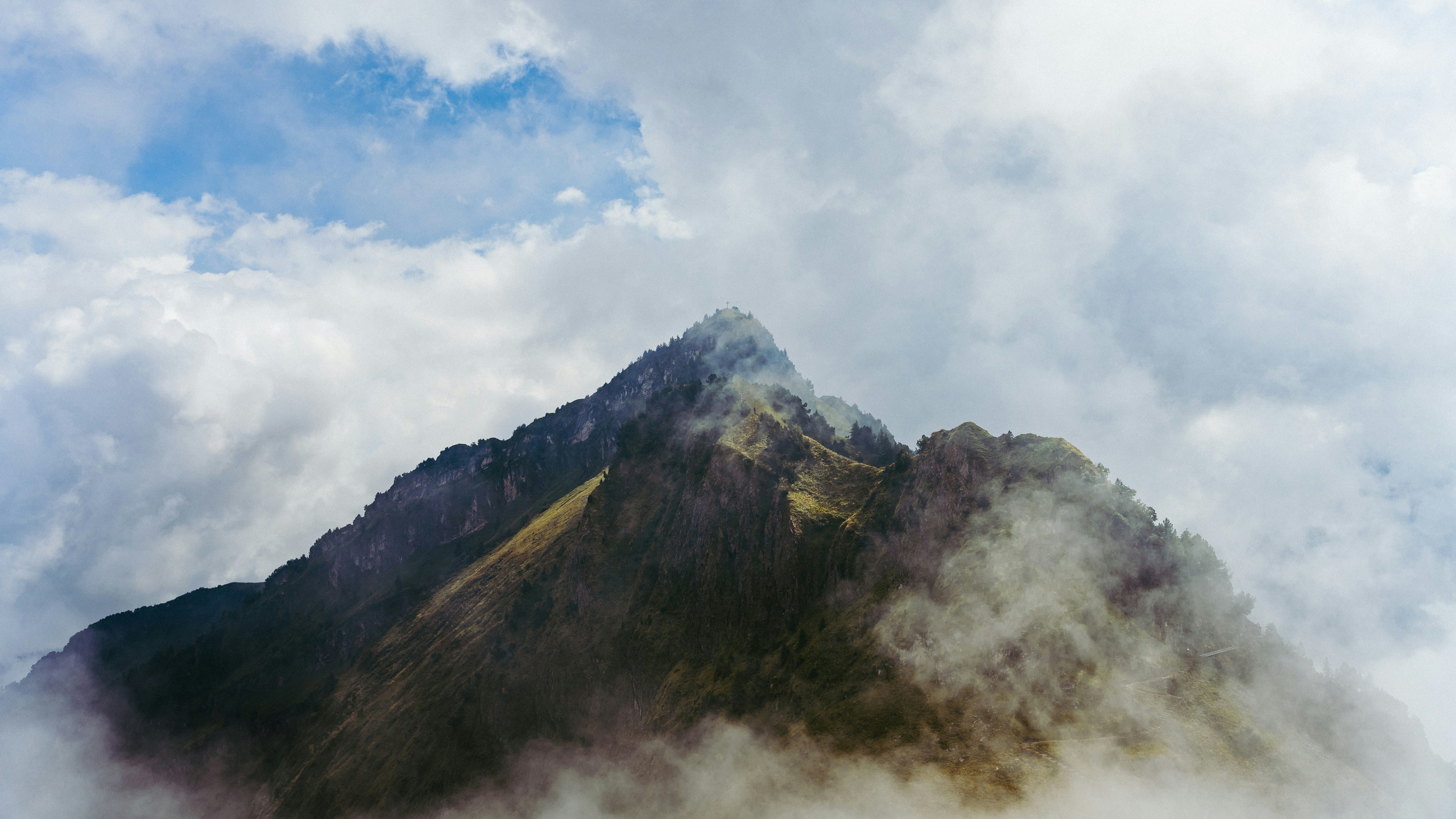 Mist Crowned Summit: A Mountain Breaks Through the Clouds