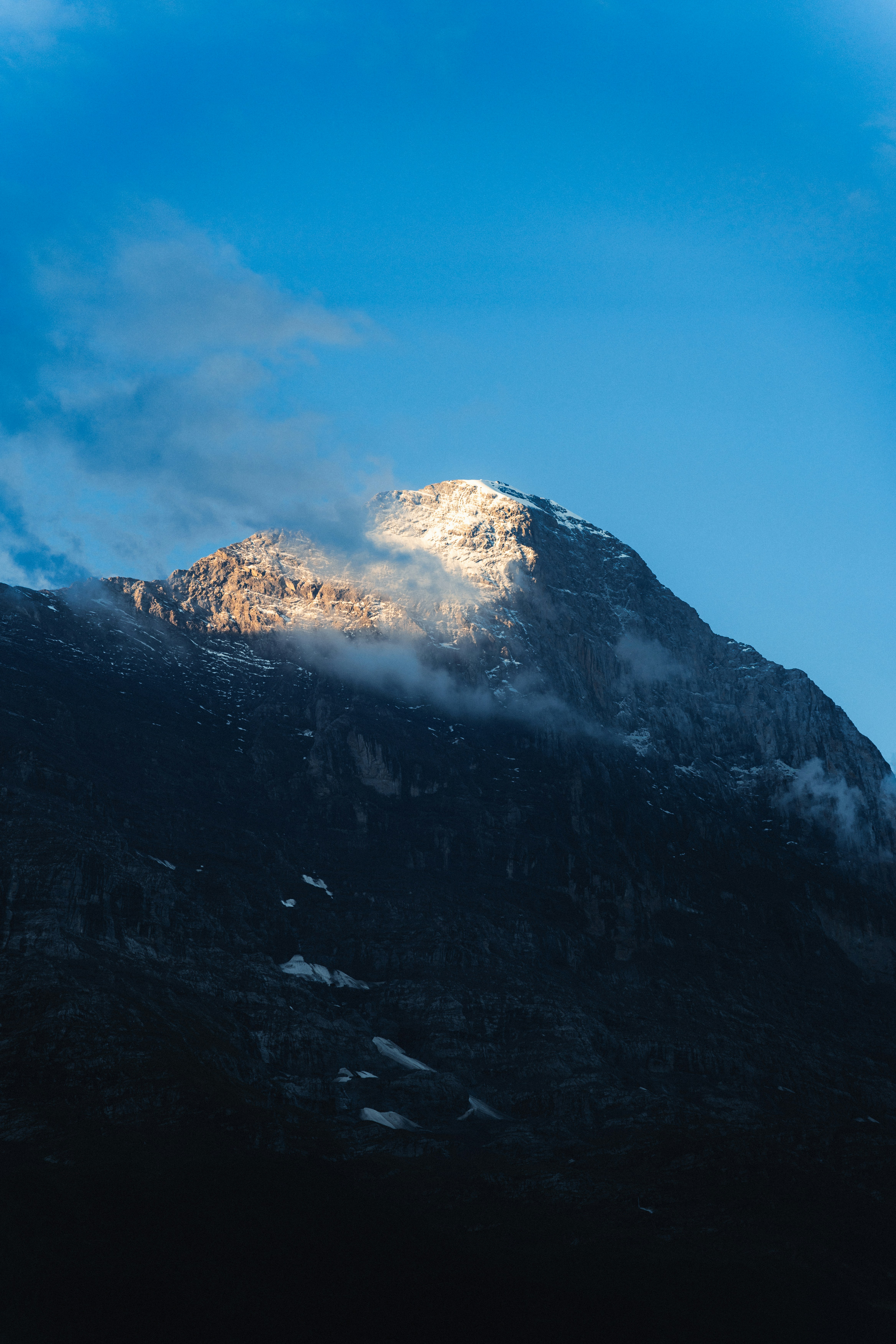 Golden Peak: First Light on a Snow-Capped Summit