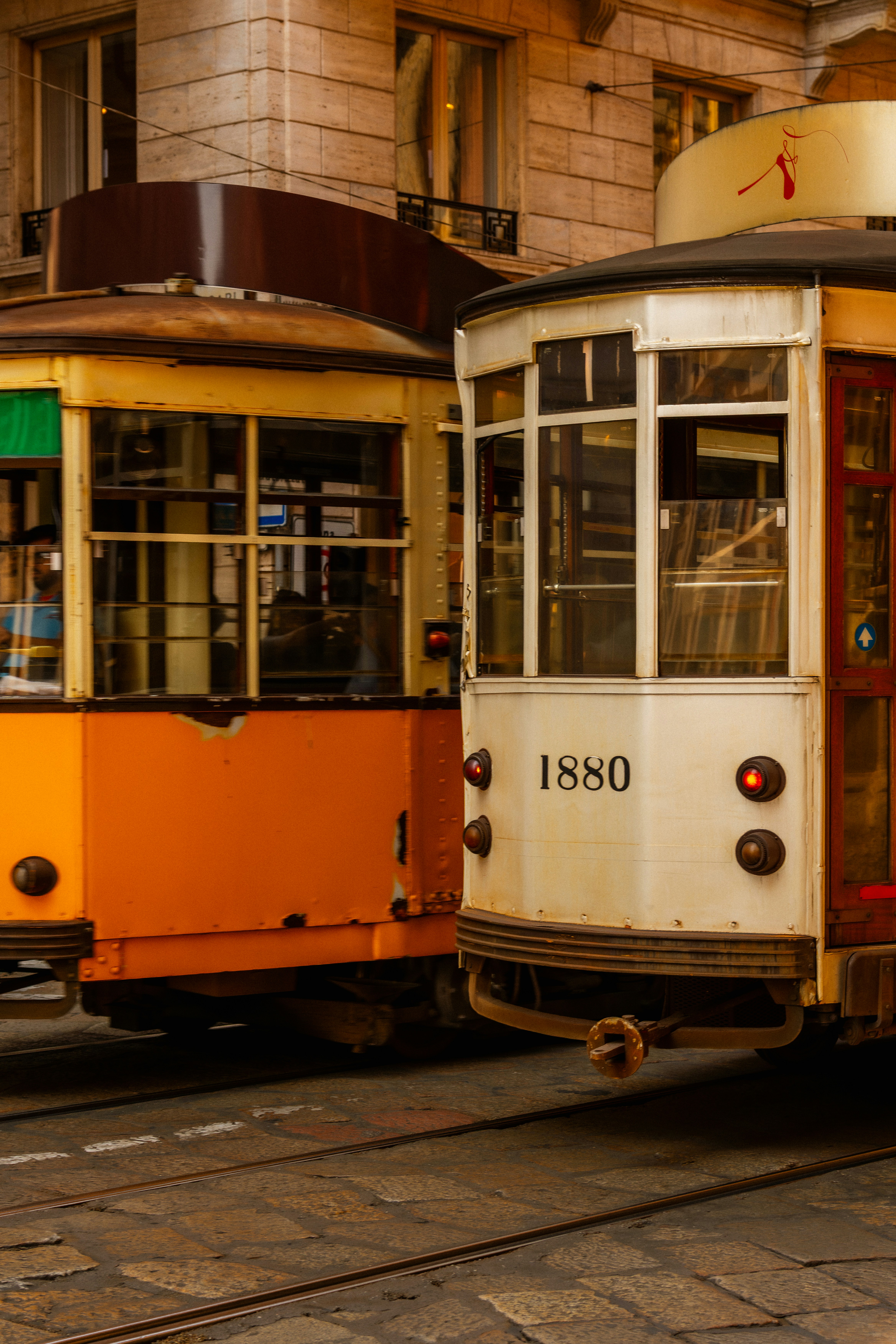 Tramway Tapestry: Urban Carriages Nestle Along a Cobblestone Street