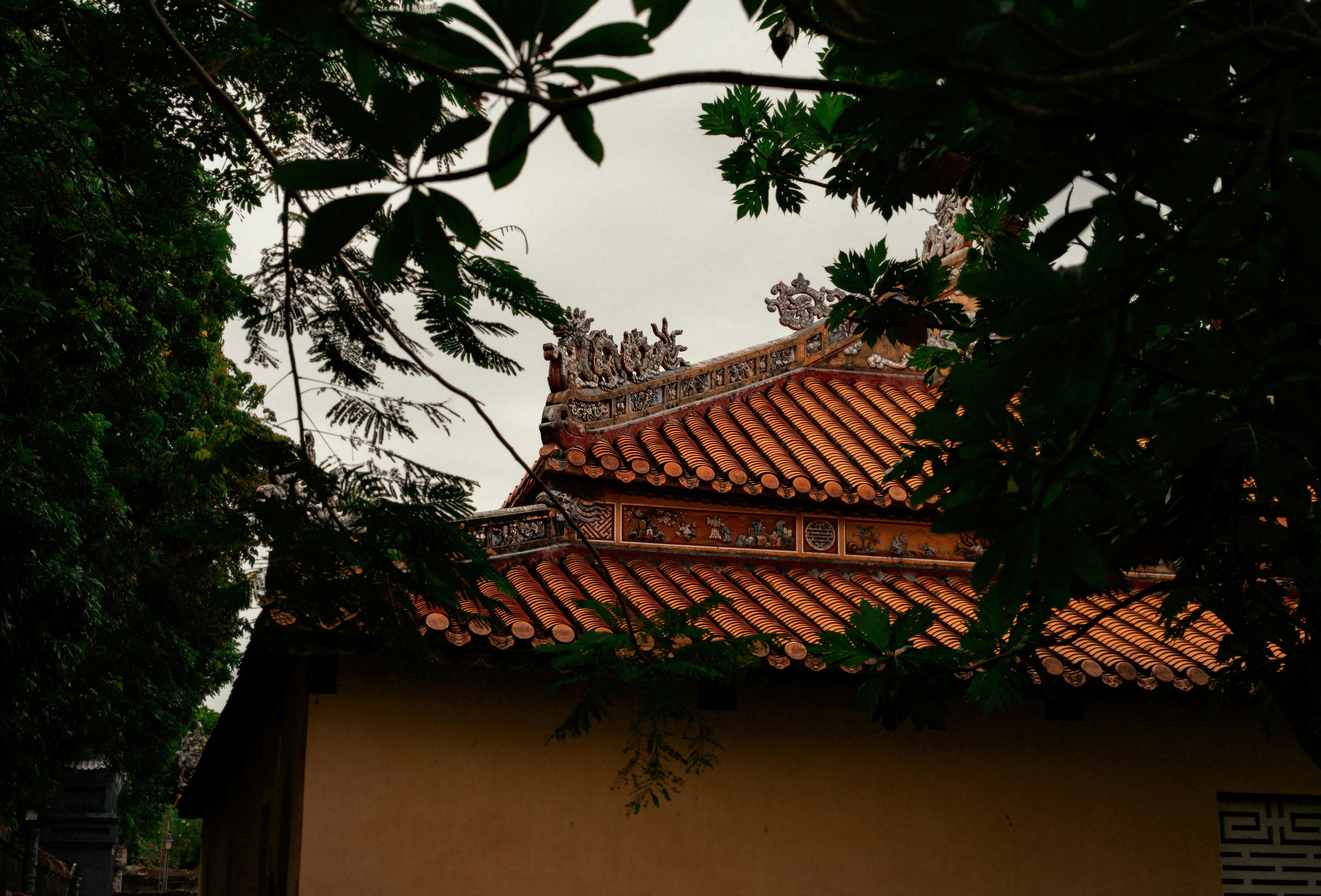 Temple Roofline Peeking Through Foliage