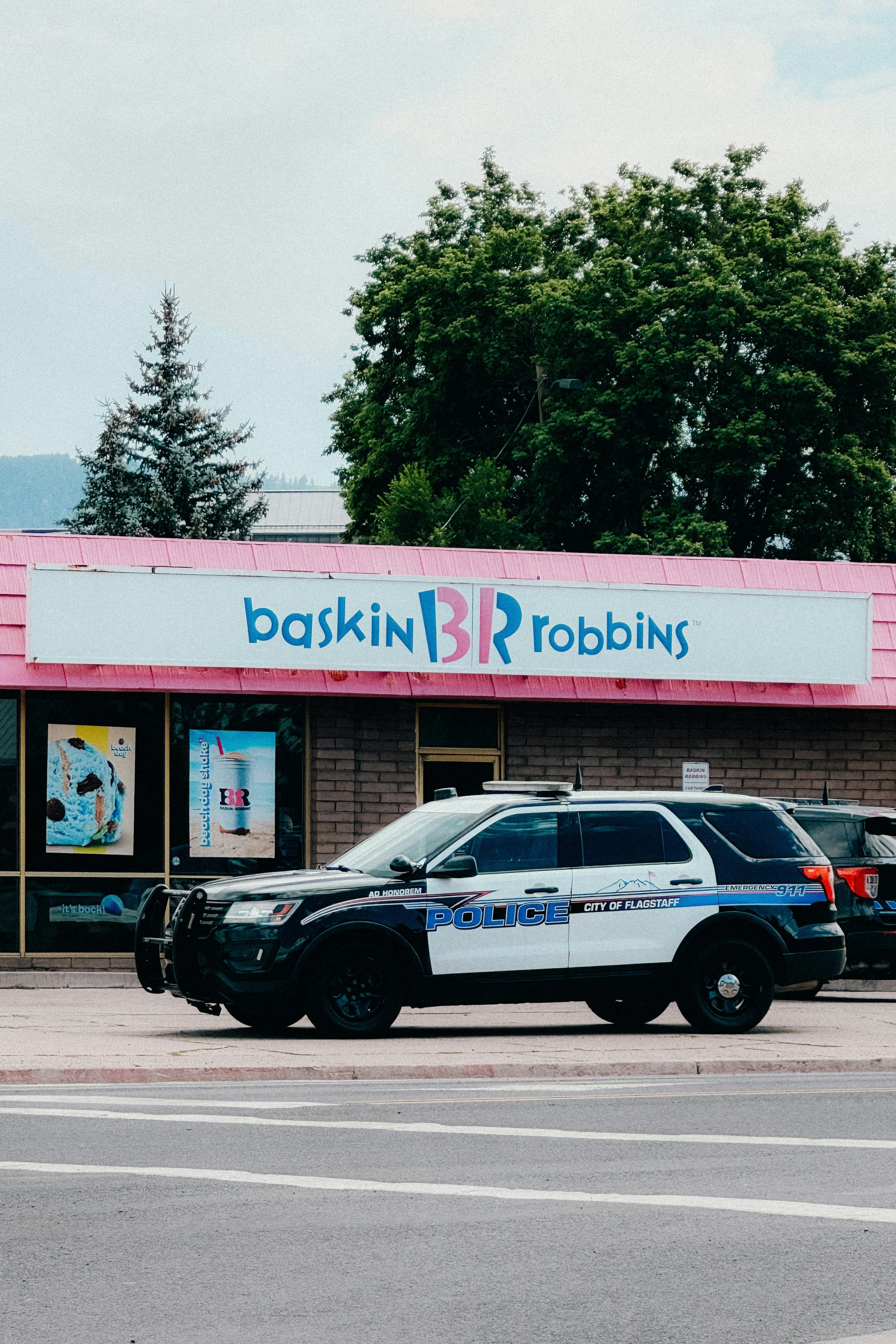 Blue-Stripe Police Presence in Front of Baskin Robbins