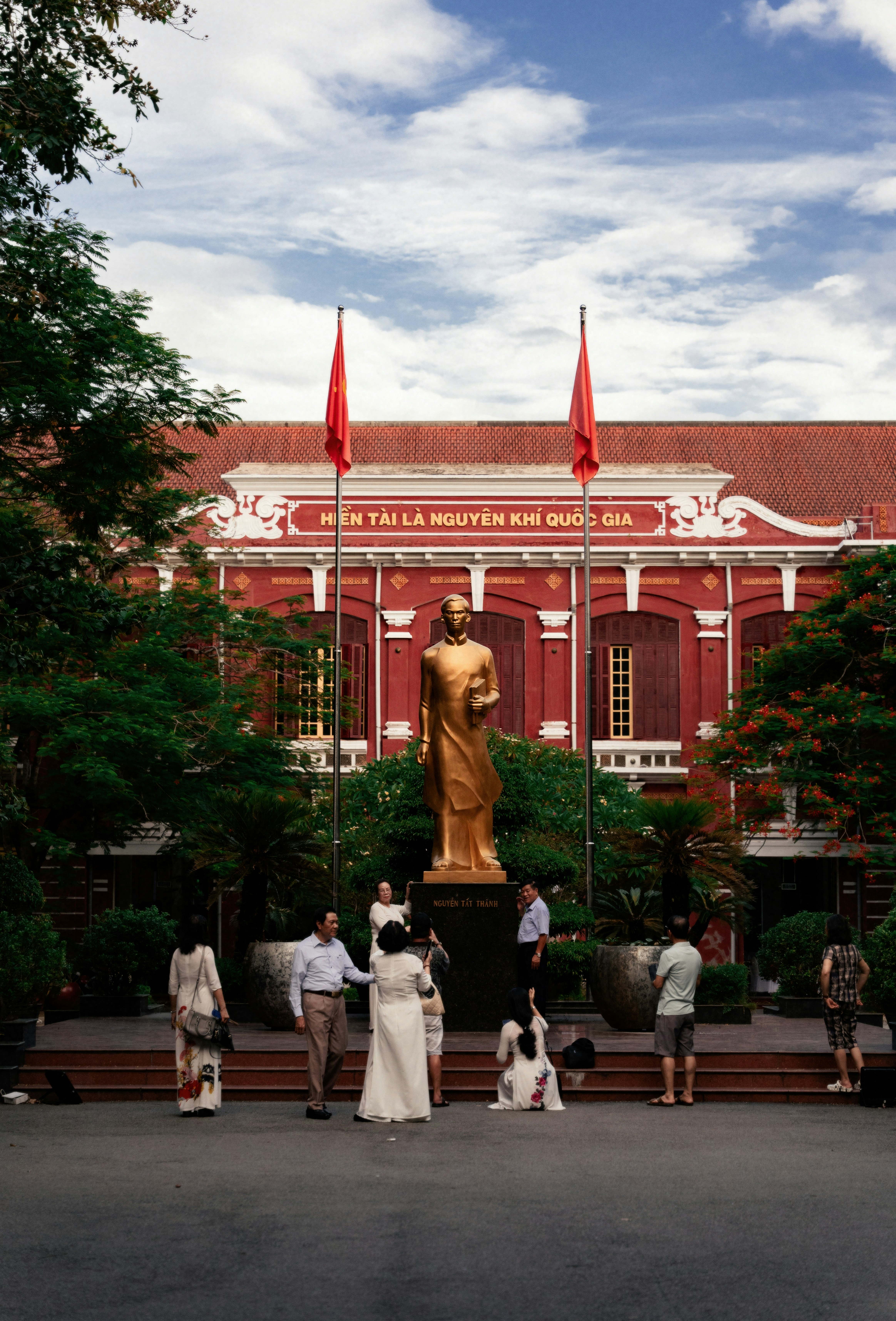 Statue and Courtyard Portrait: Ceremony Before the Red Brick Archive