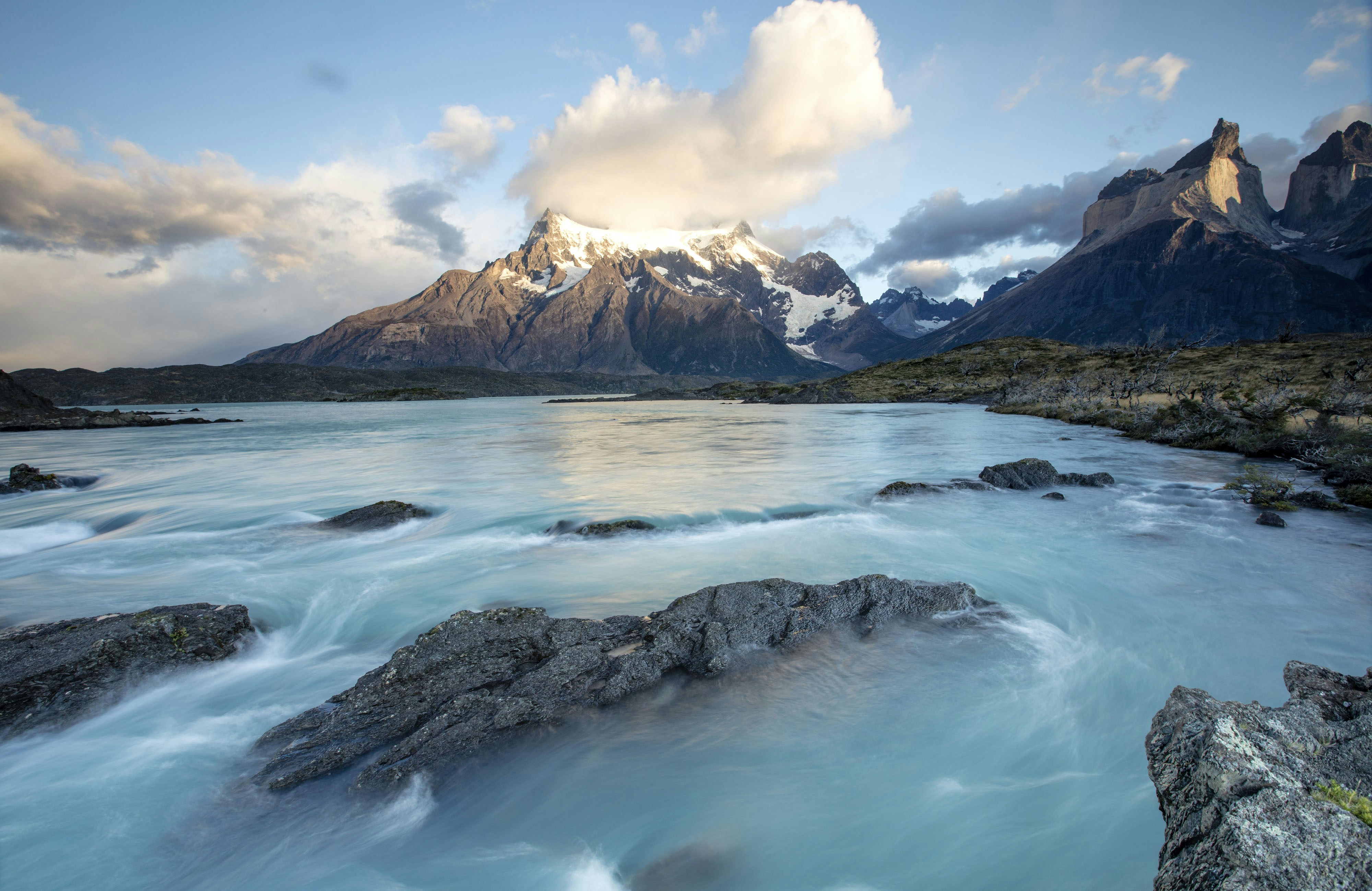 Glacial River Confluence Beneath Snow-Capped Peaks