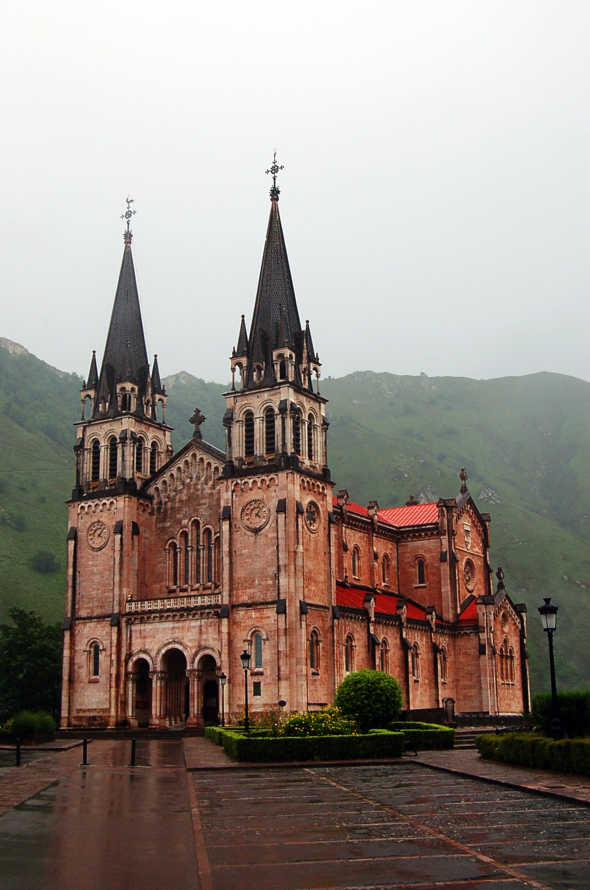 Twin Spires Over Green Hills: A Riverside Cathedral Portrait