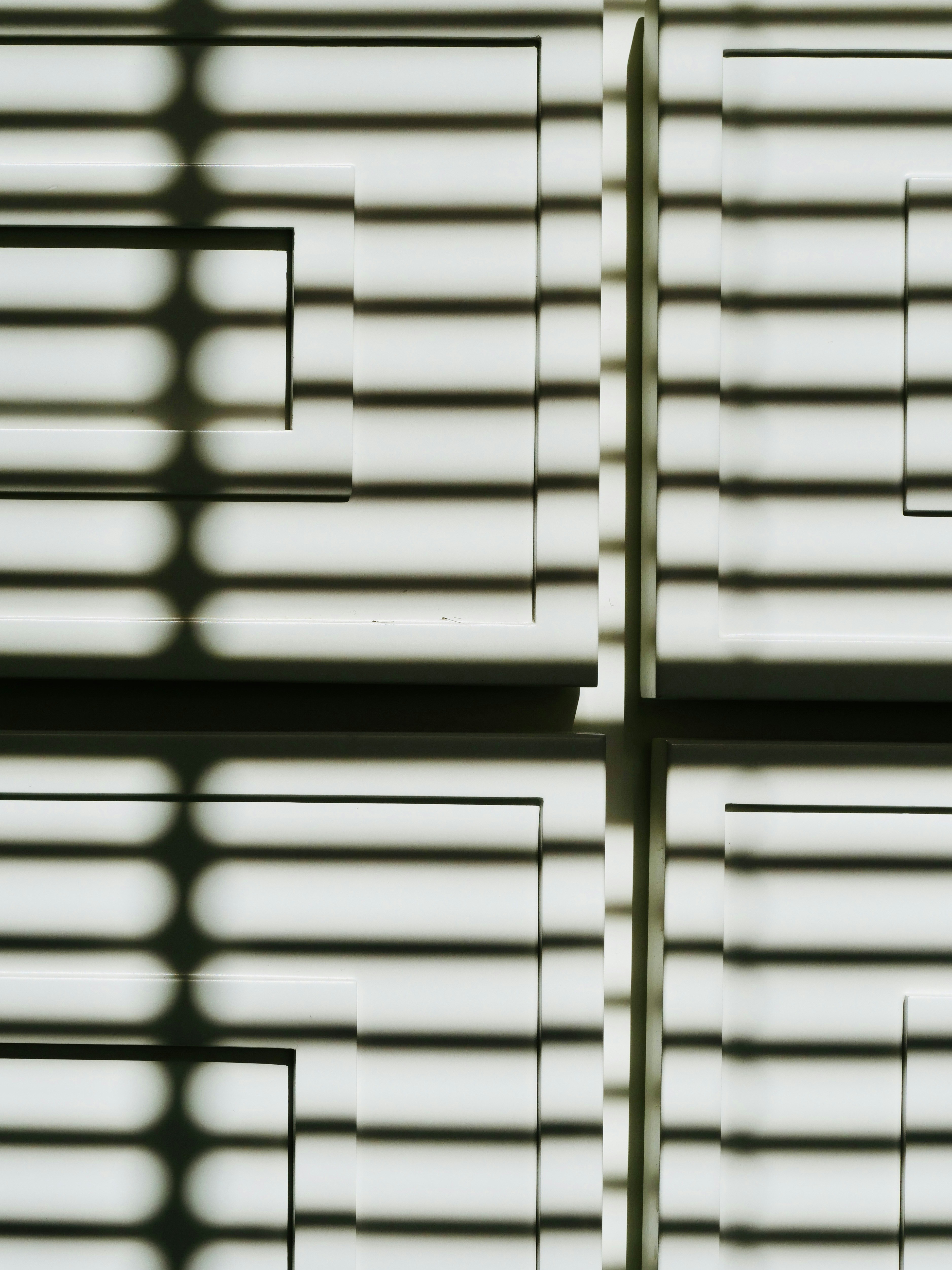 Patterned shadows on a bathroom cupboards