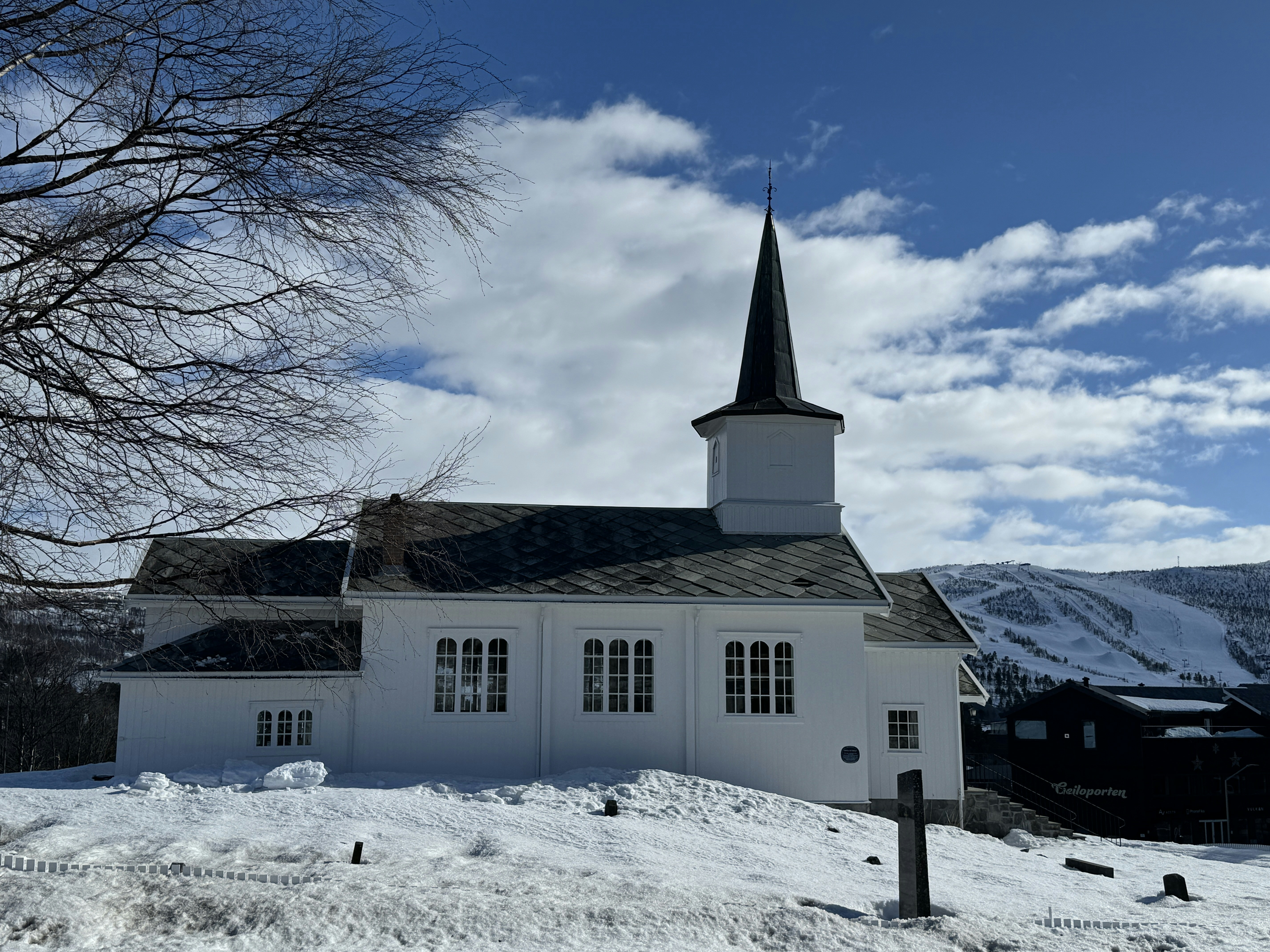 White Chapel in Snow Under a Clear Sky