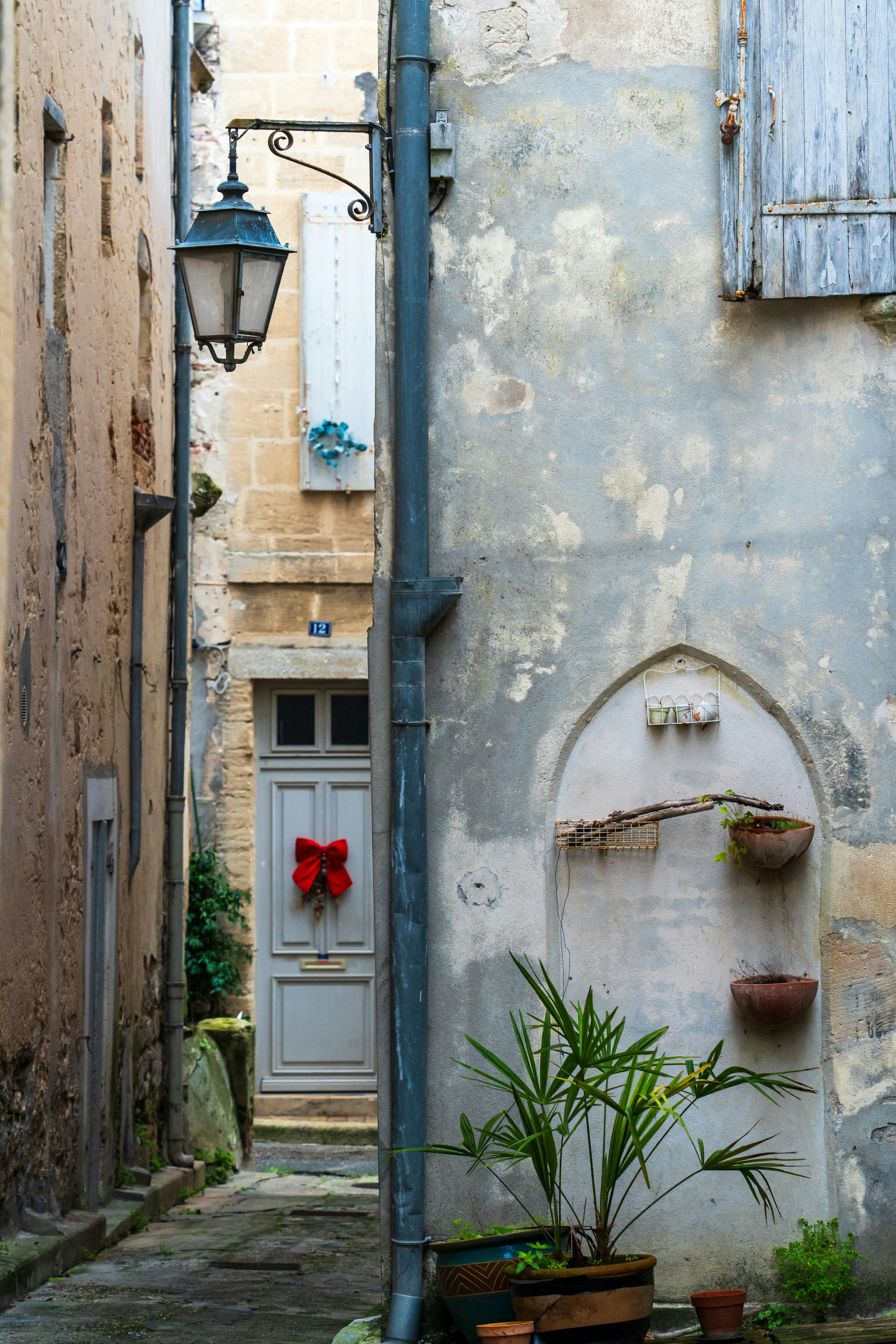 Red Bow in a Mediterranean Alleyway