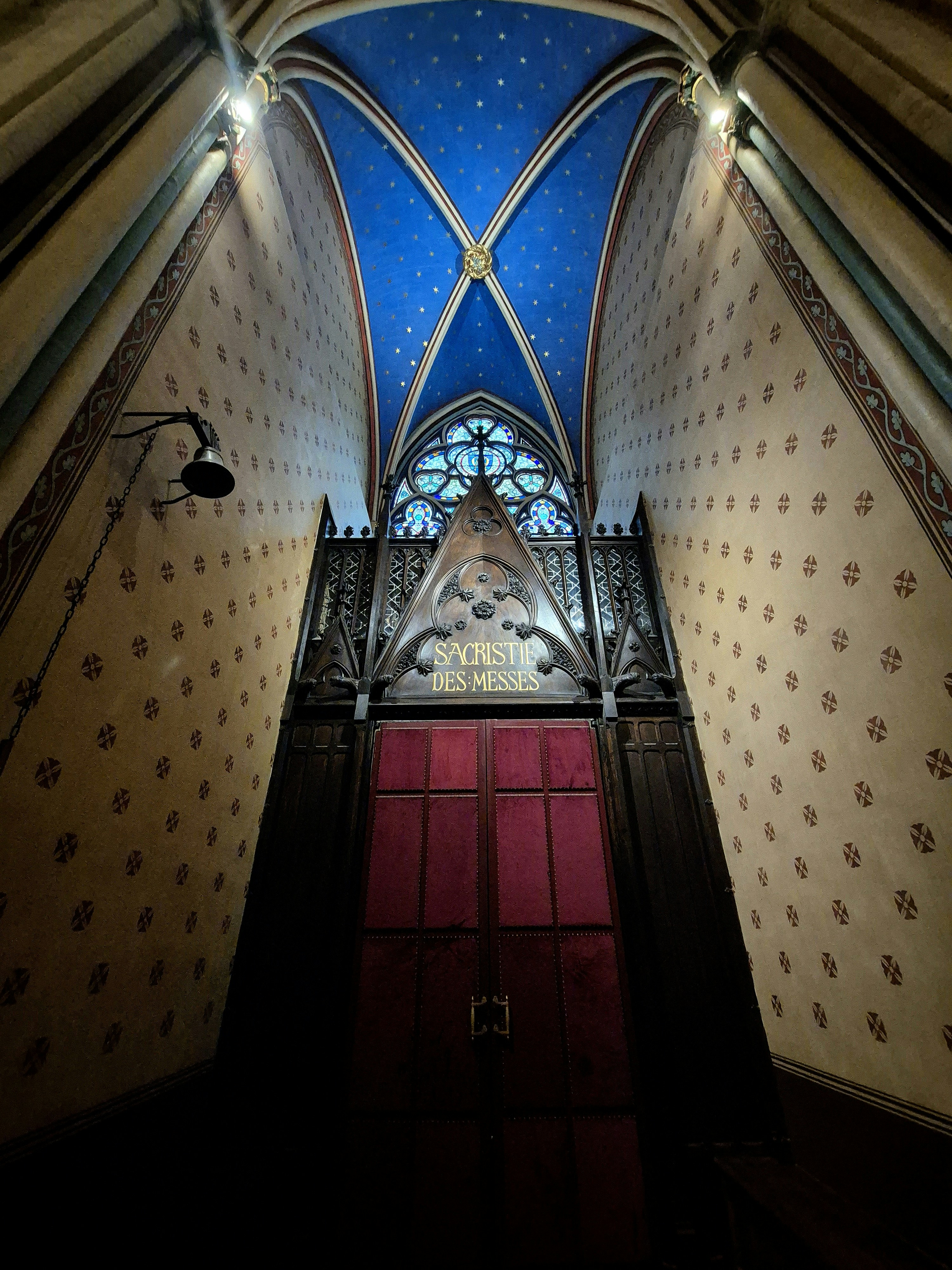 Gothic Triad: Arching Vaults Framing a Regal Door