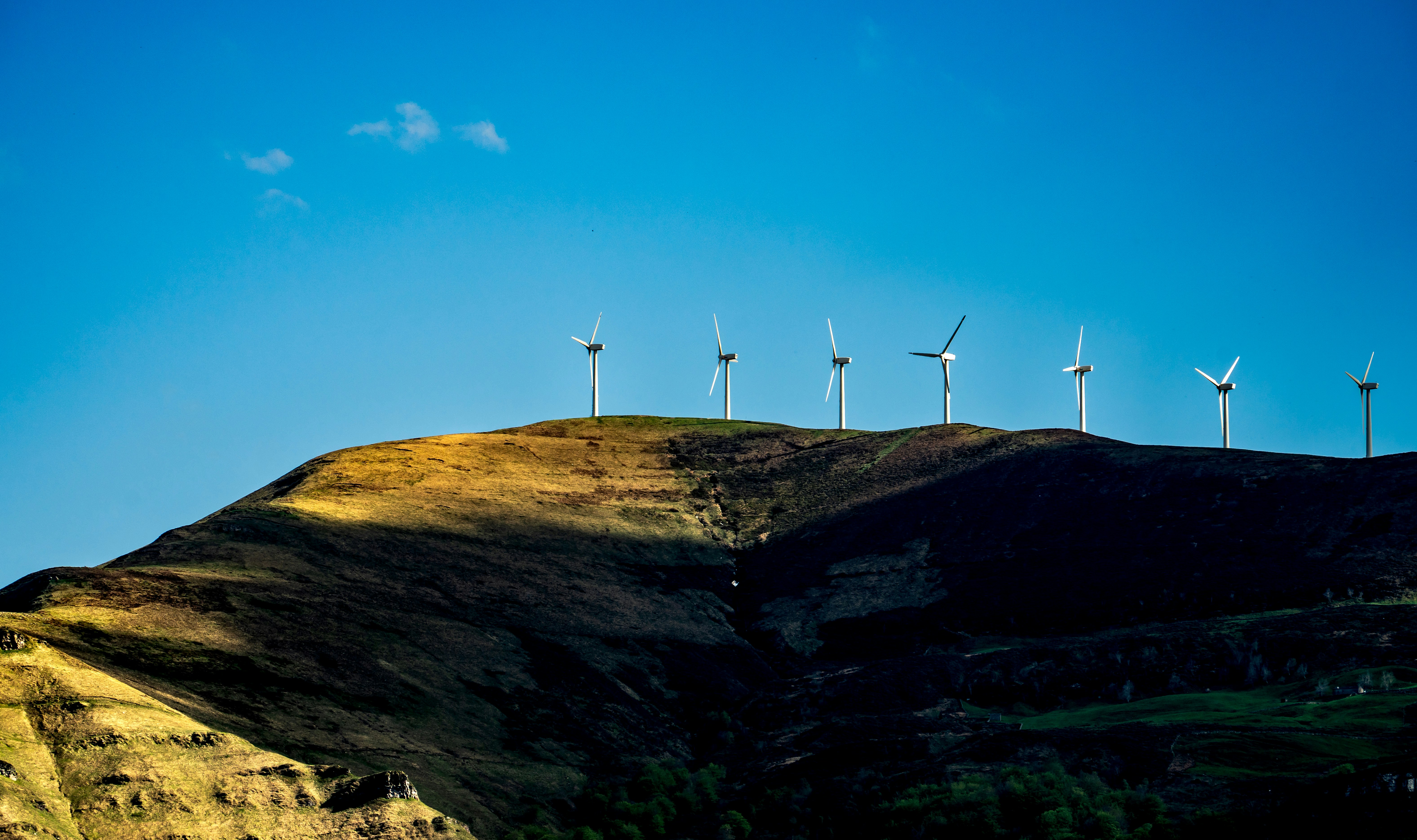 Windward Ridge: A Row of Turbines Crown the Hill at Dusk