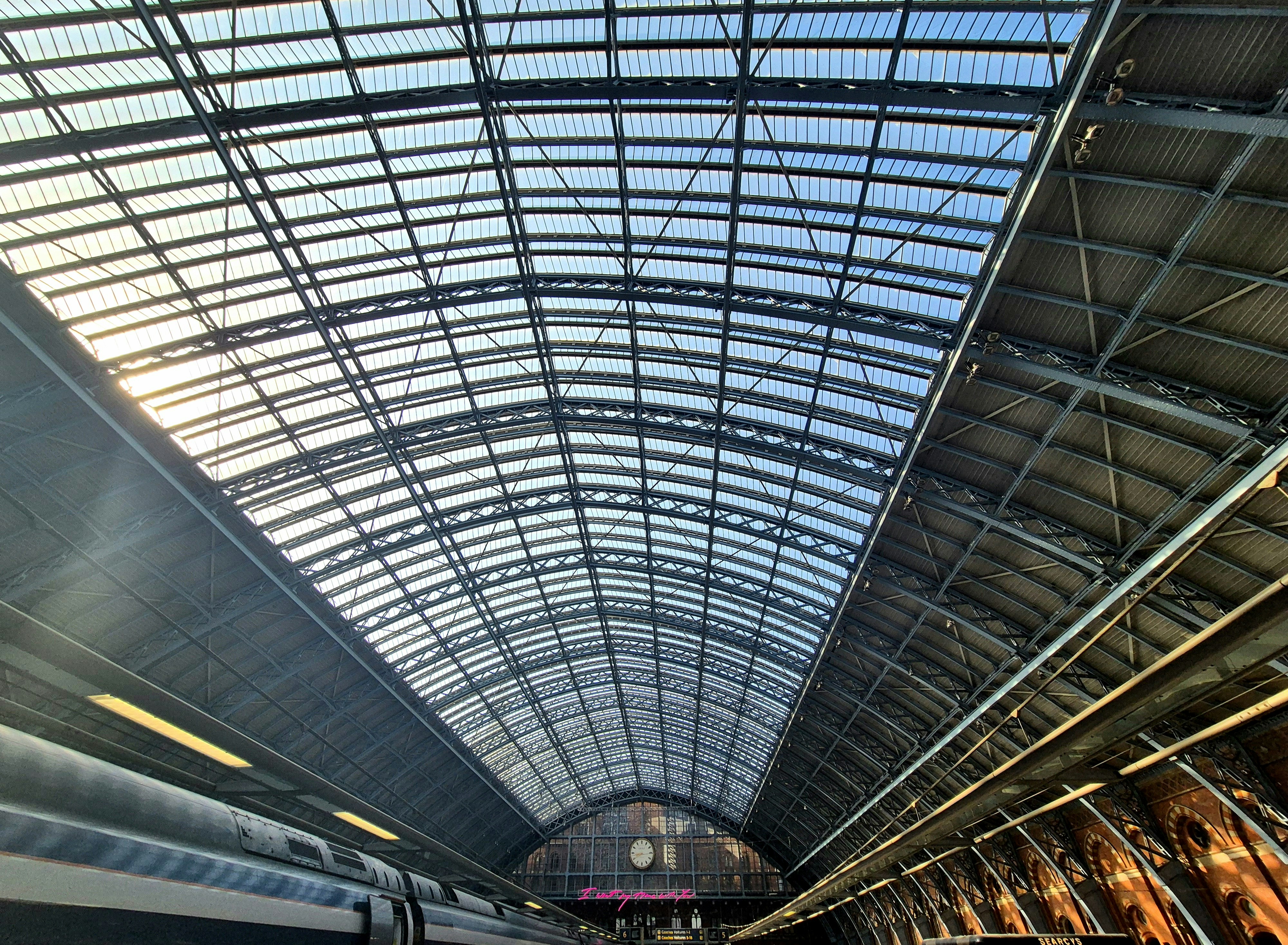 A vaulted train station awash in morning light