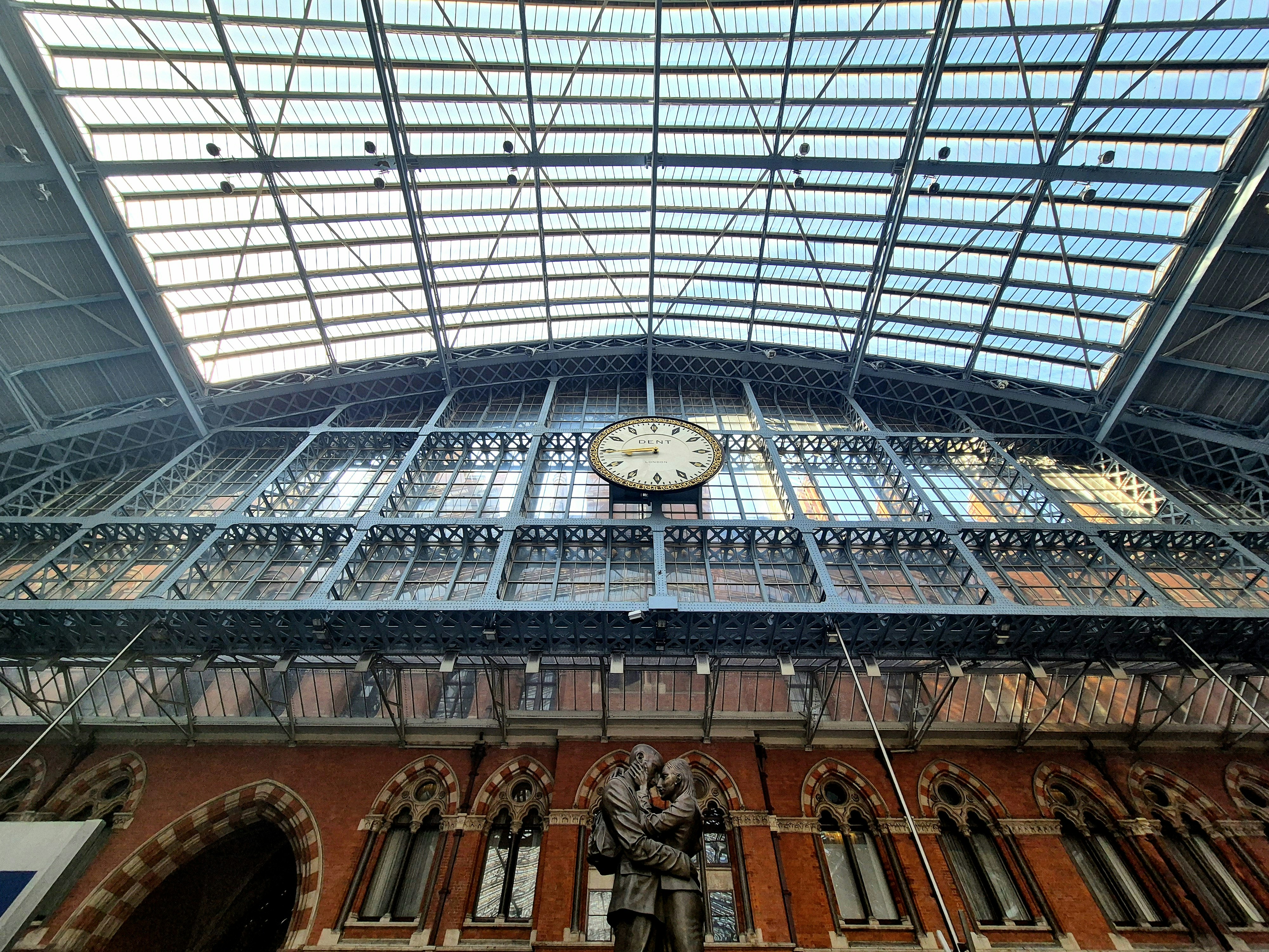 Clock Tower Hall: A Grand Ceiling and Brick Facade Meet