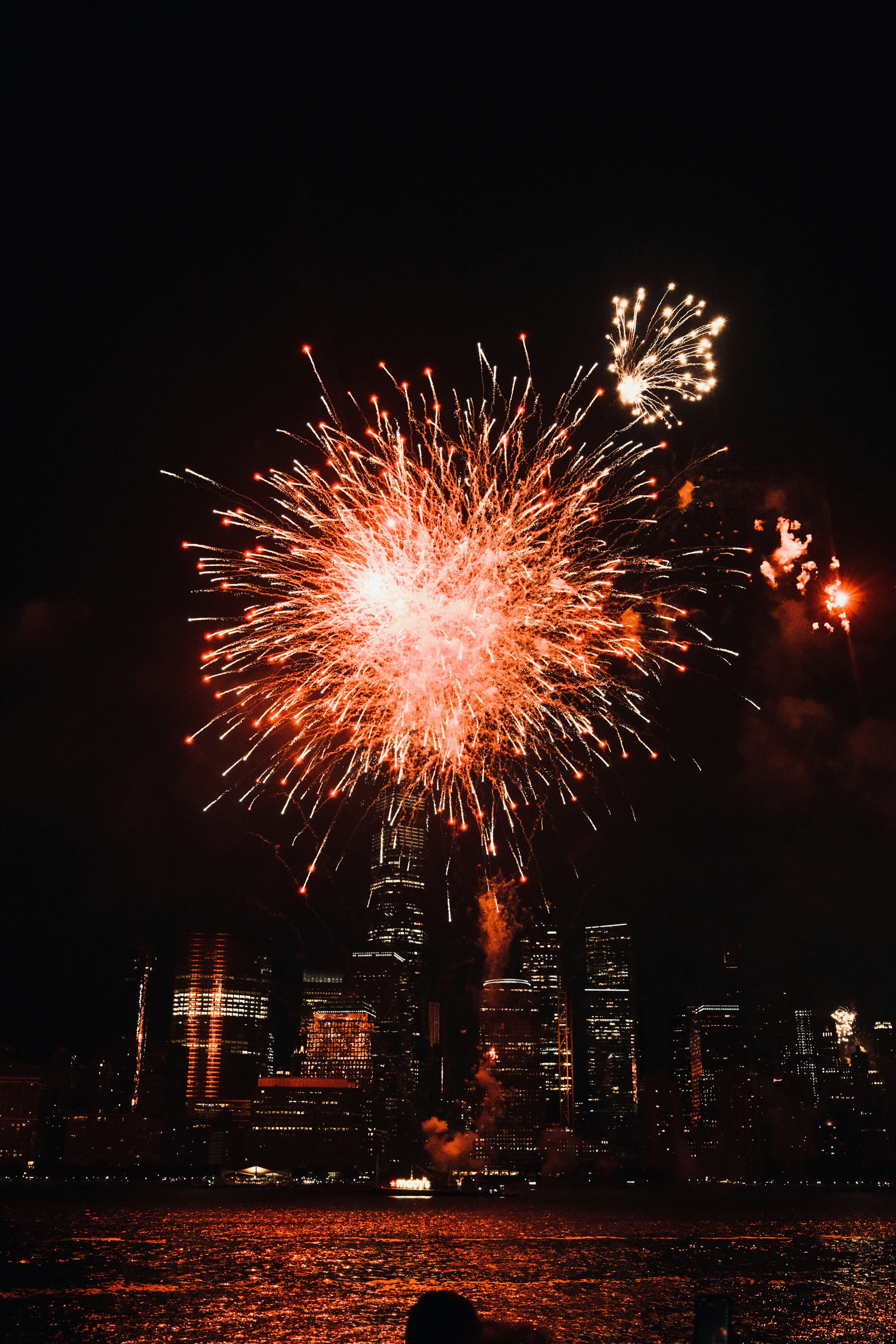 Midnight Skyline Bursts: Fireworks Above a City Silhouette