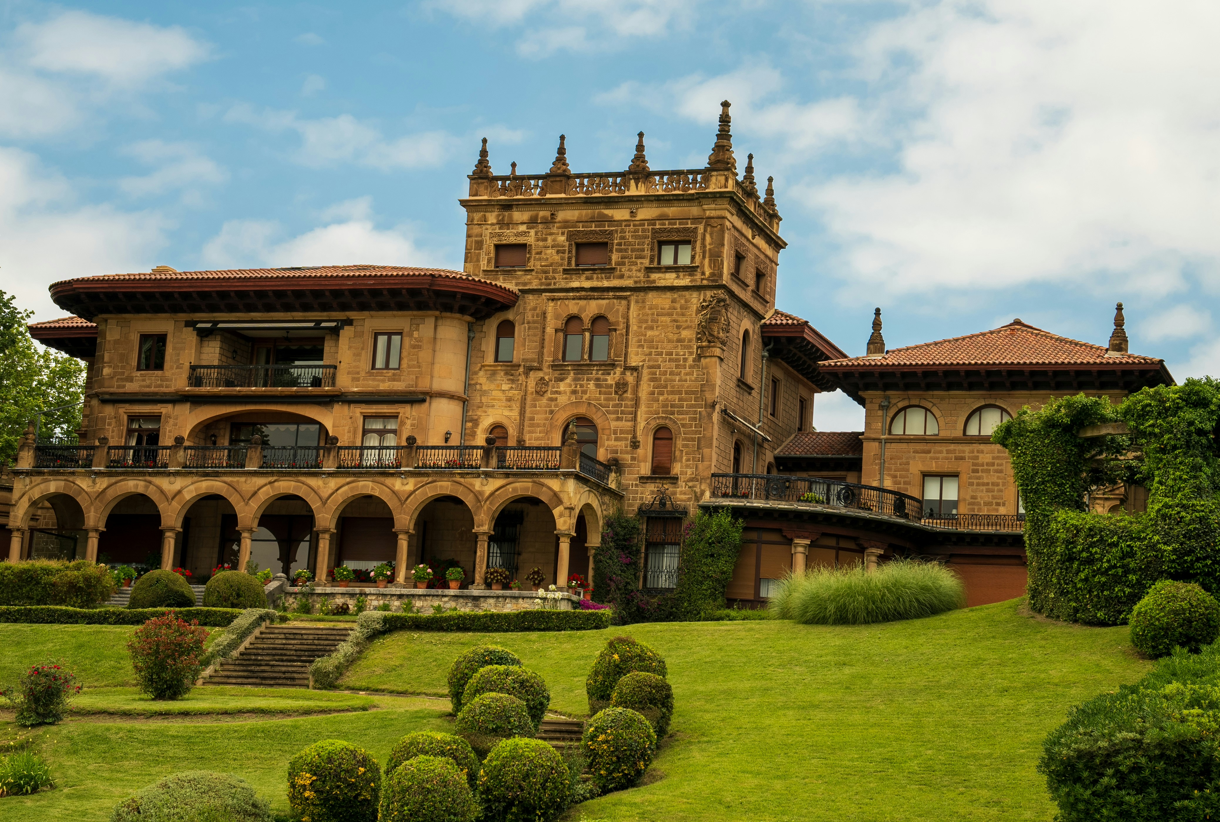 Castle-Style Villa Overlooking Circular Hedges and Terraced Lawn