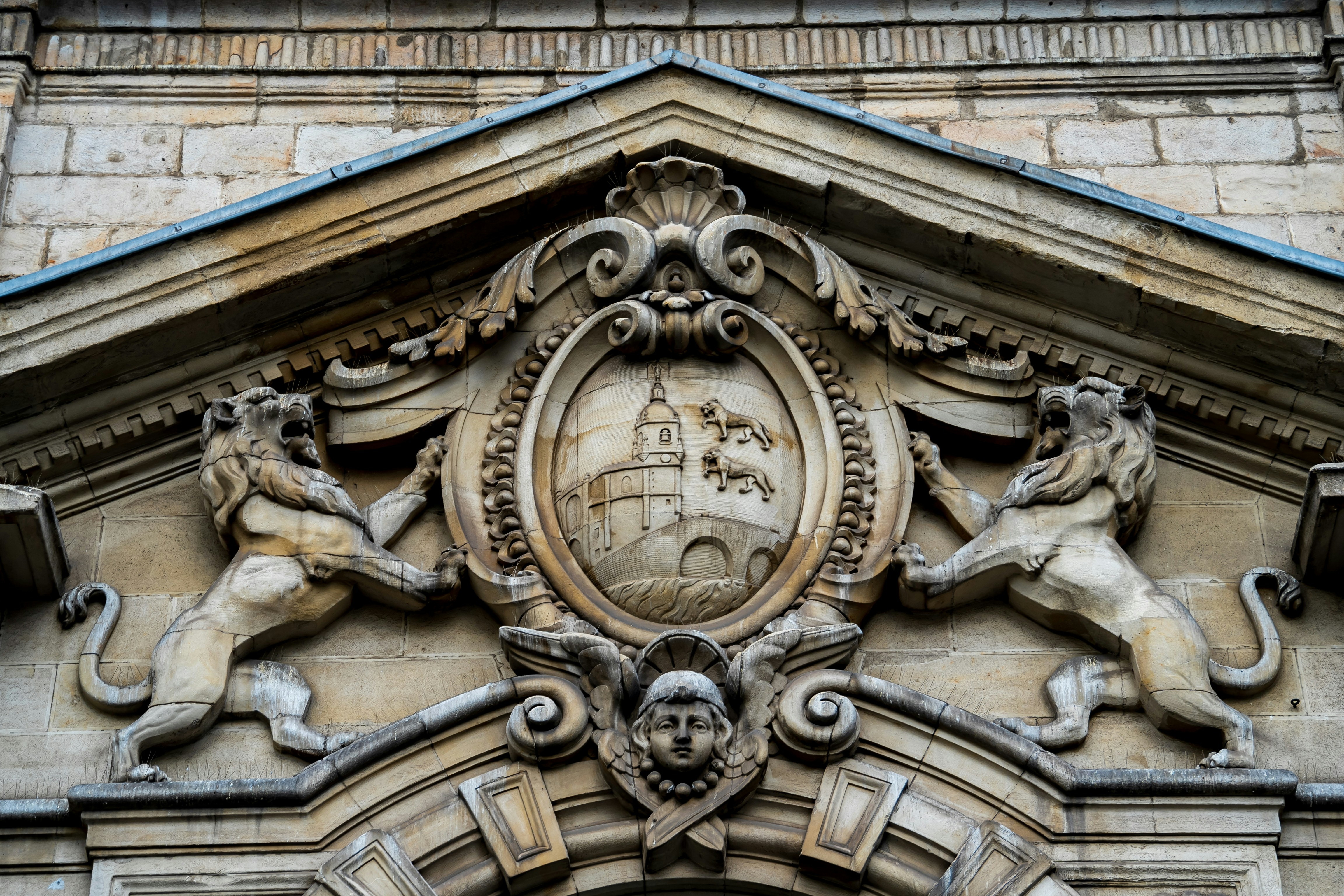Carved Wyvern Crest Over a City Gate