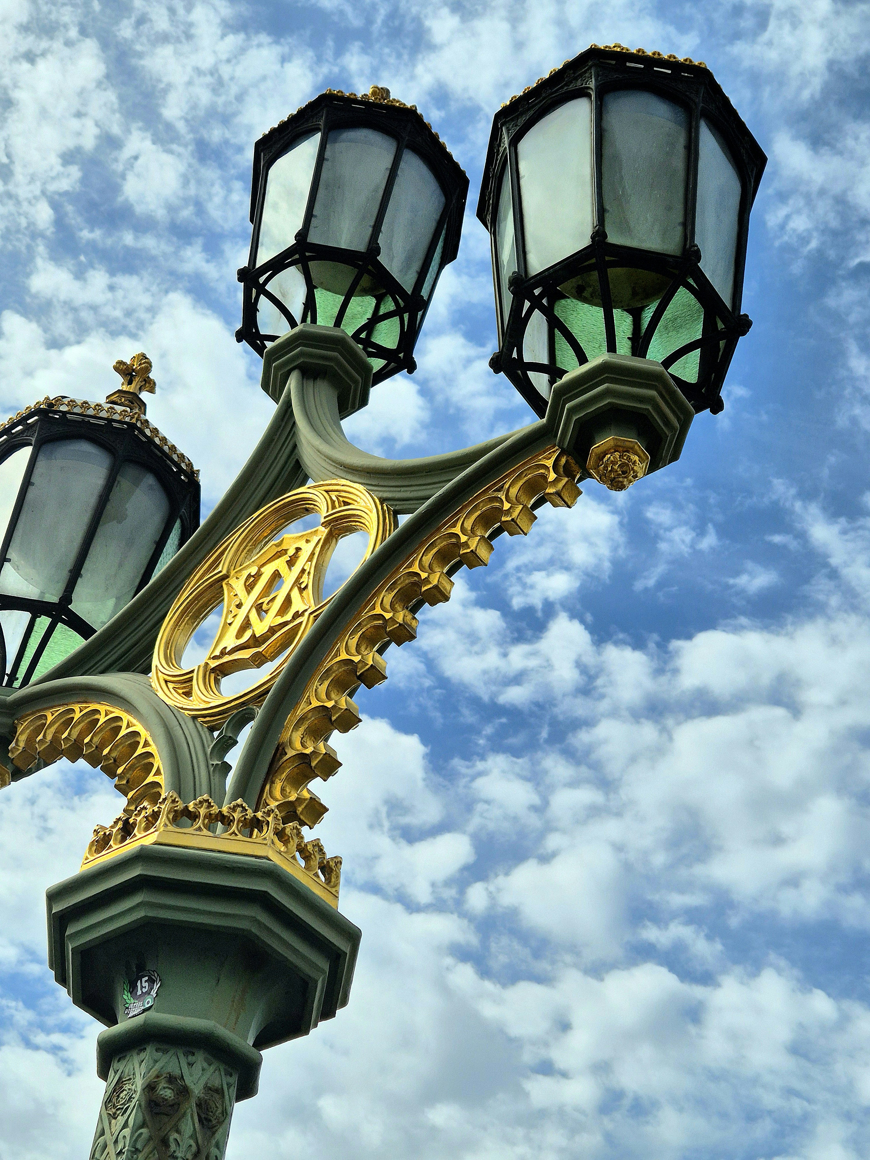 Ornate Lantern Crown: A Historic Streetlamp Reaches Toward the Sky