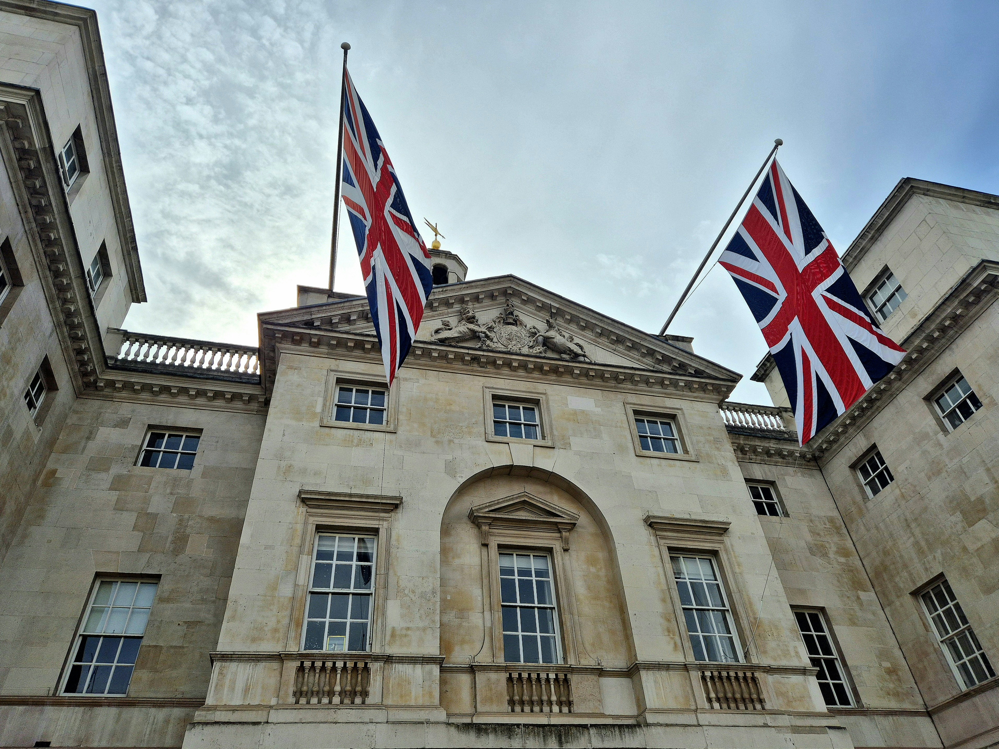 Flagged Facade: Union Jack Shadows over a historic British-inspired building