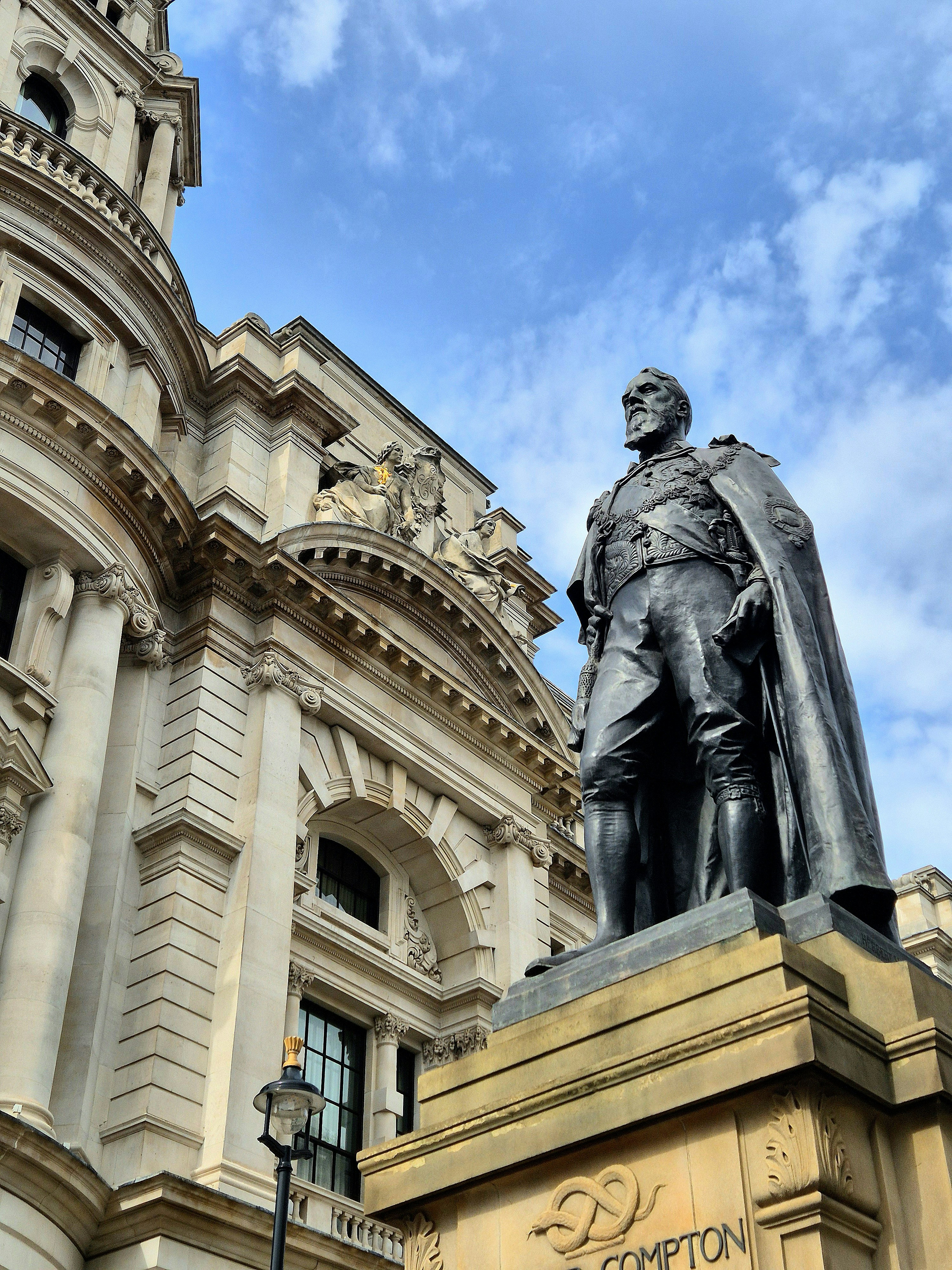 Statue and ornate facade: a grand architectural portrait