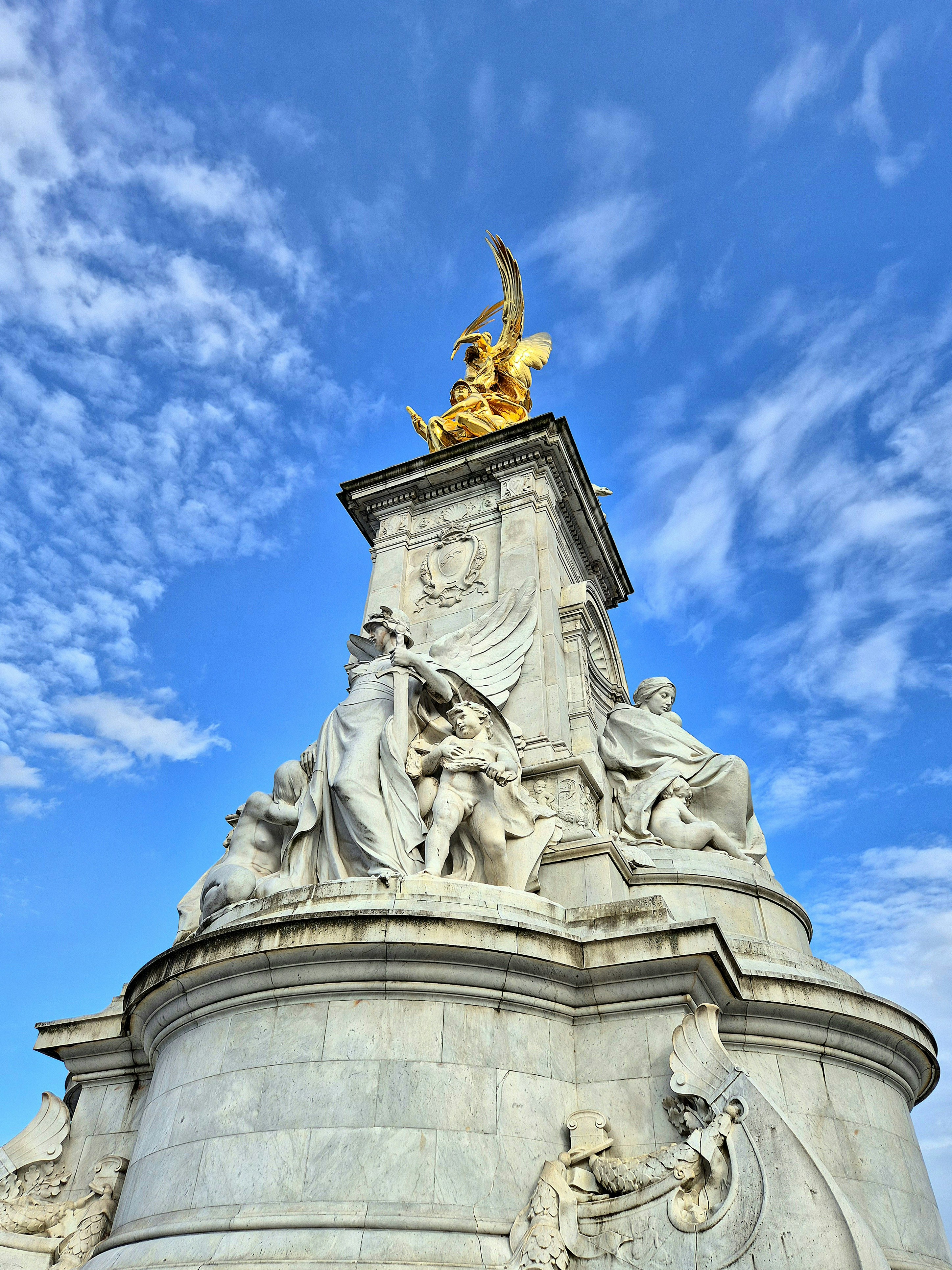 Gilded Angel Overlooking a Marble Pedestal