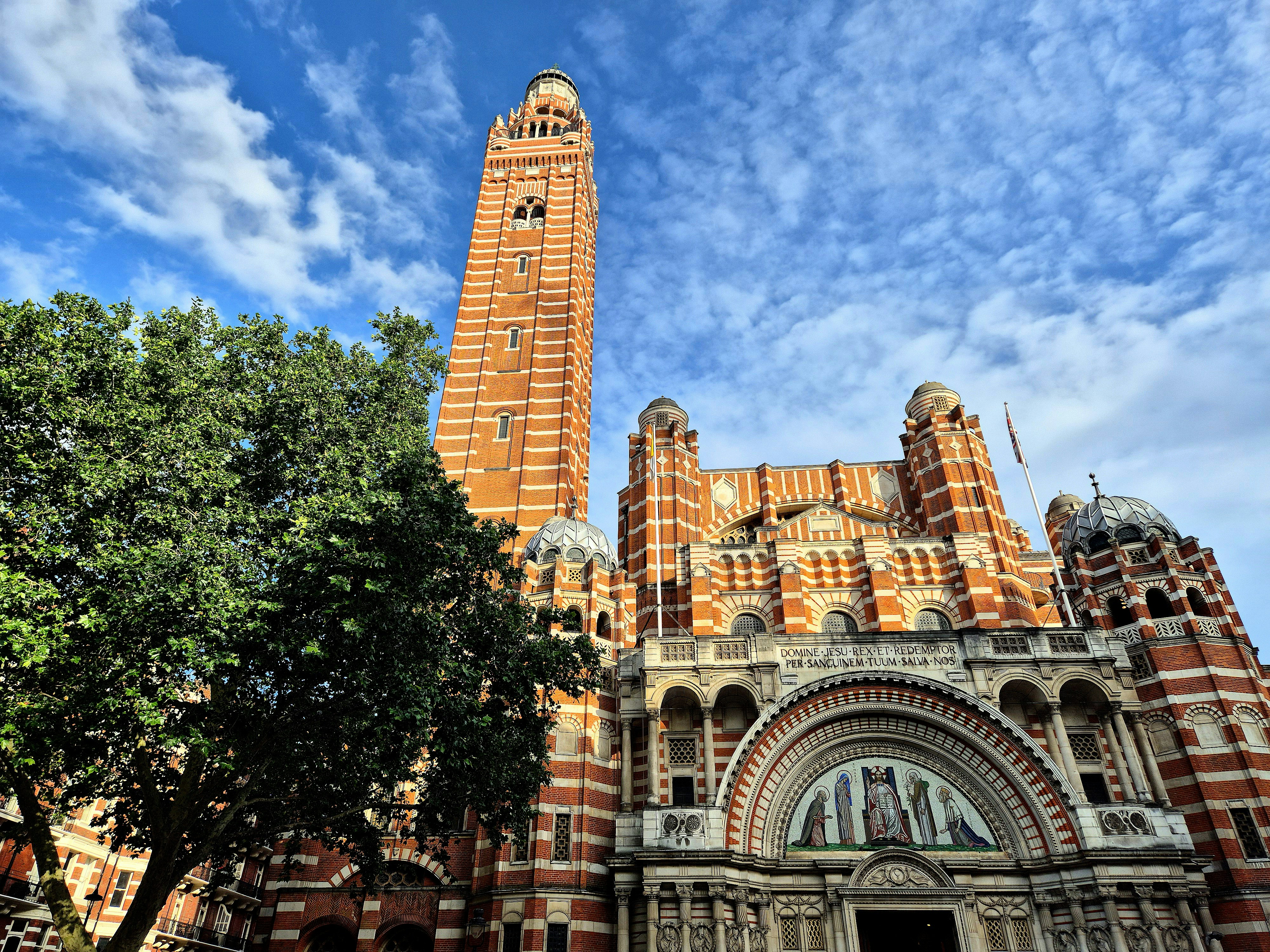 Brick-and-stone Cathedral Towers Over a Blue Sky