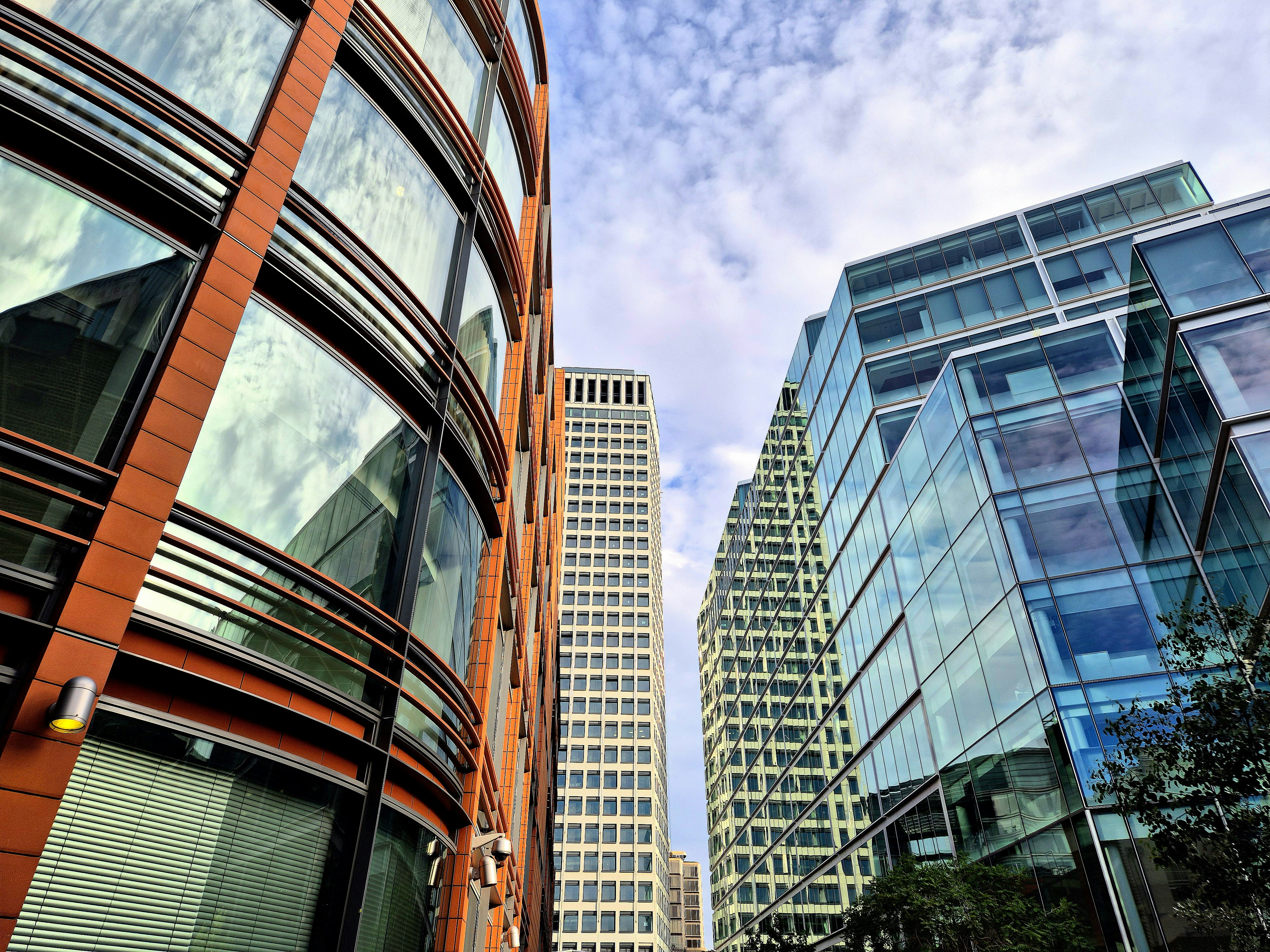 City Canyon: Glass and Brick Skyscrapers Reach for a Bright Sky