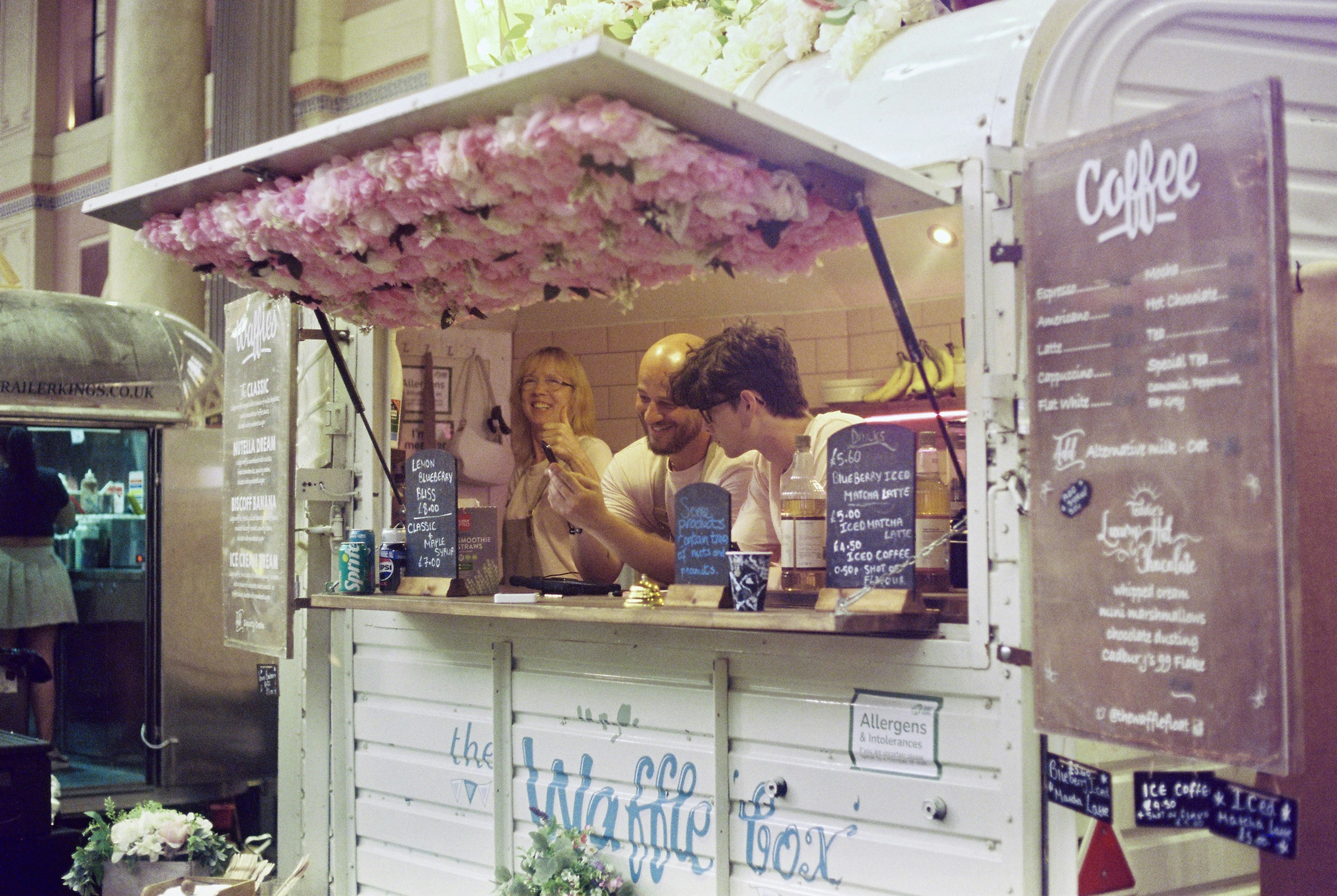 Cozy Waffle Wagon: Artful Crepes and Coffee Behind a Floral Frame