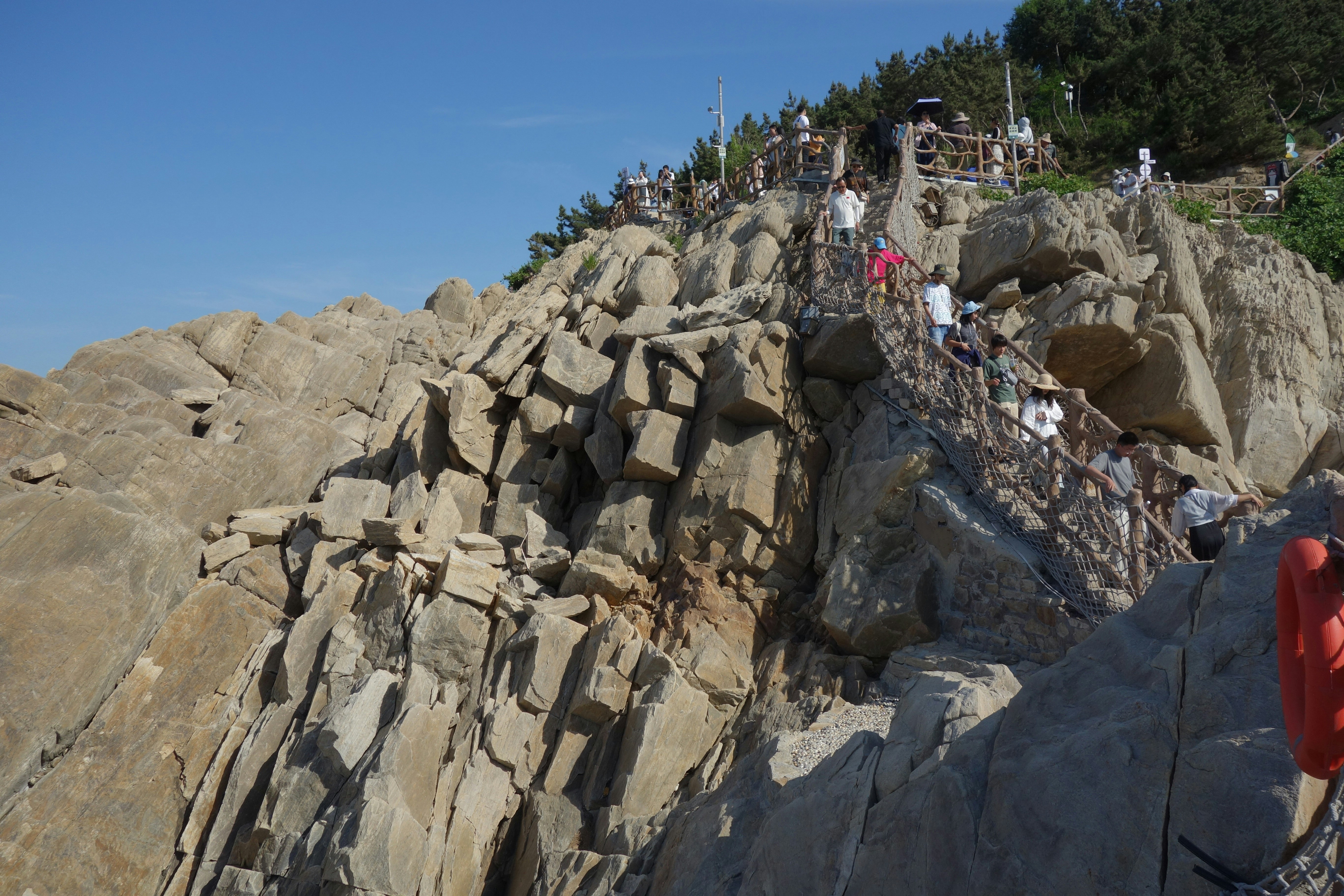 Crowd Trek on a Granite Ridge