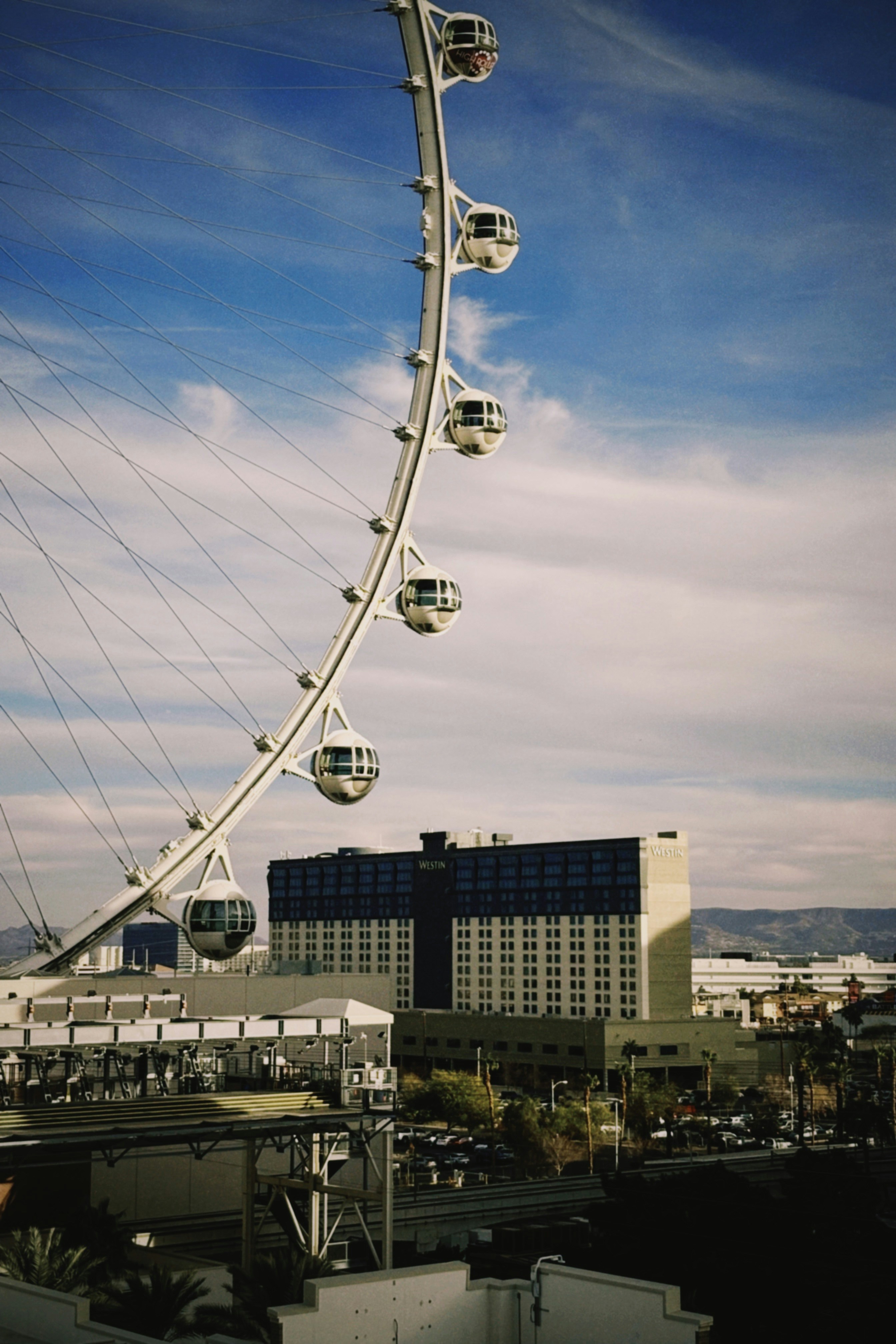 Rising Wheels: A Ferris Arc Over Las Vegas Architecture