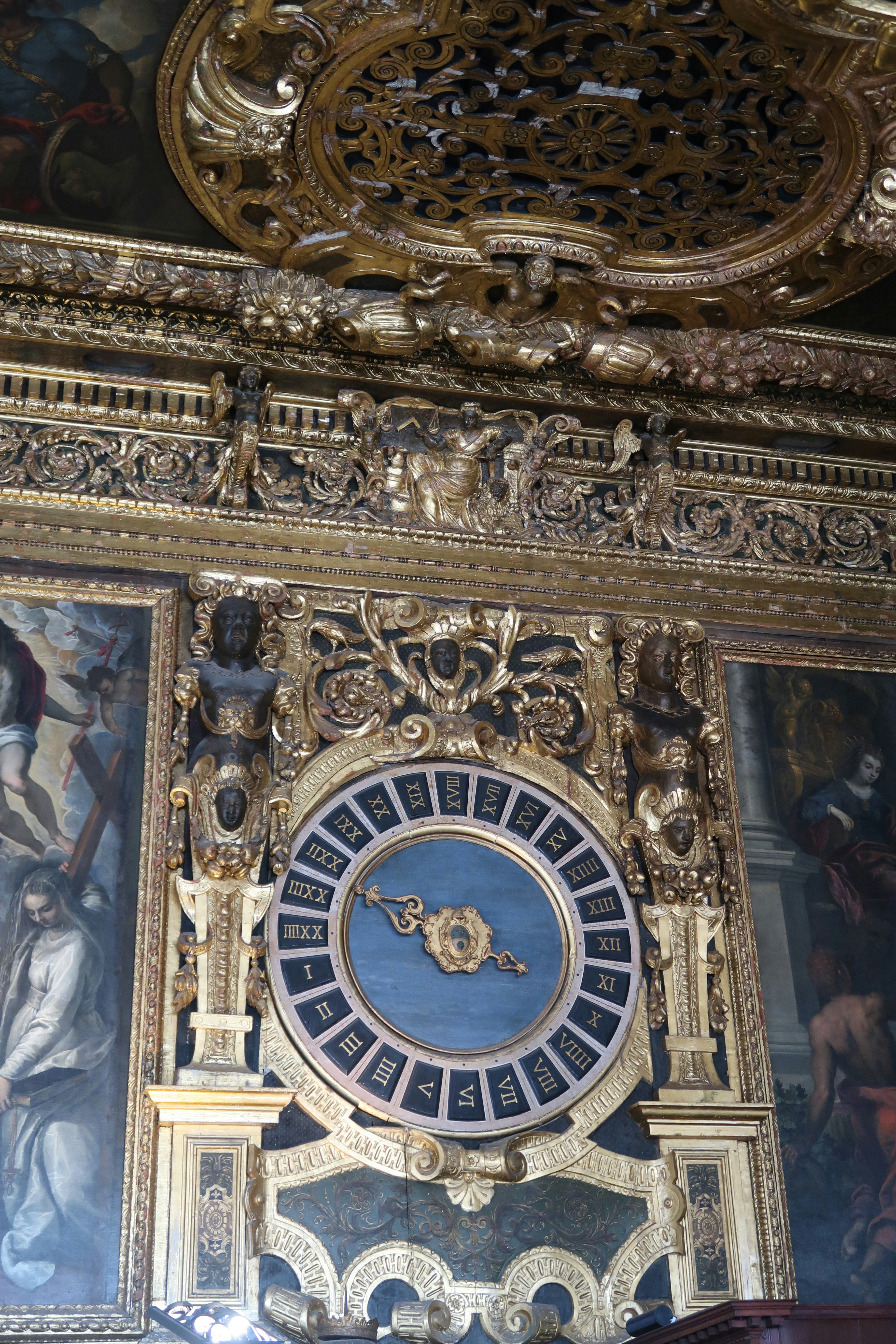 Ornate clockwork: gilded baroque facade framing a moonlit dial