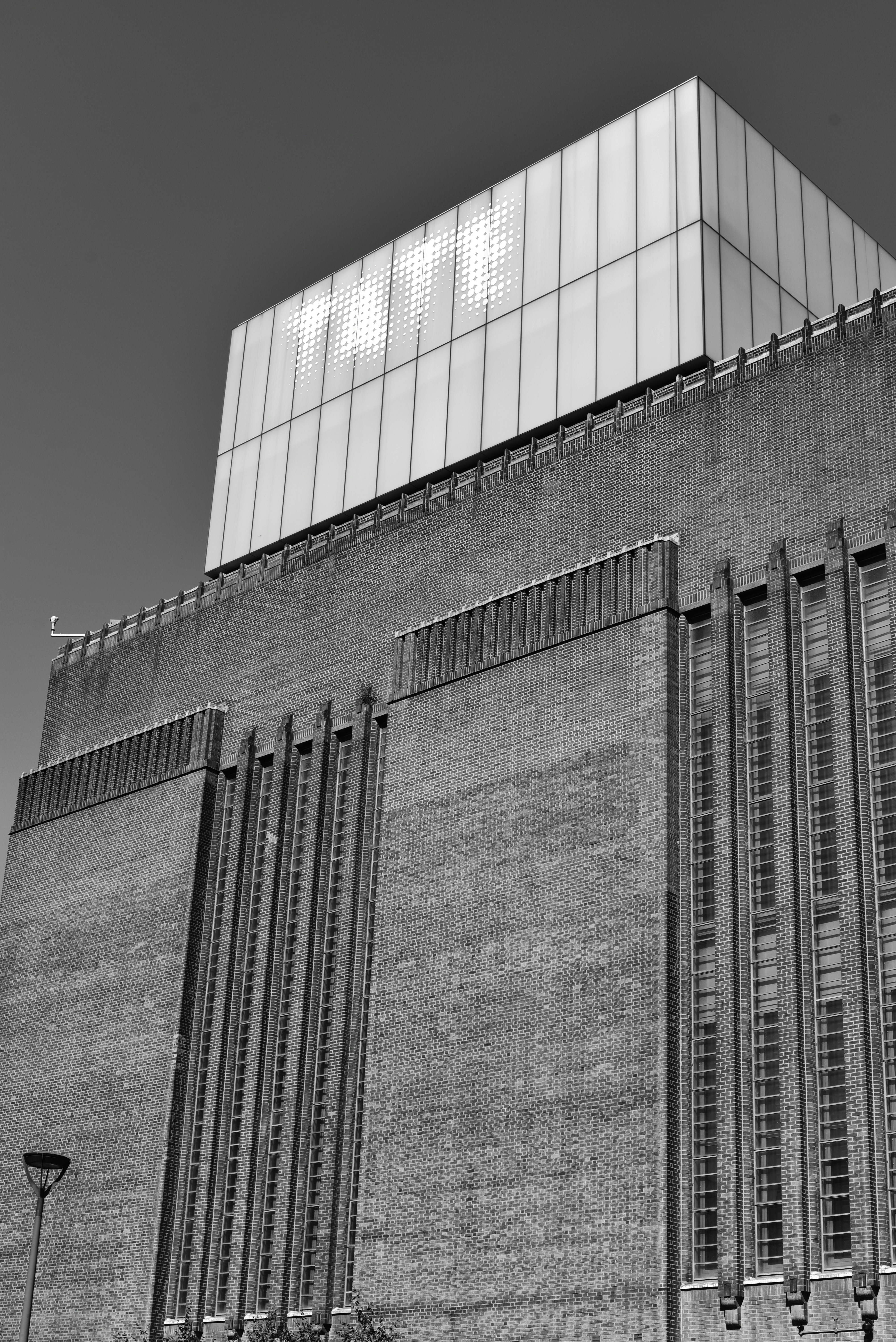 Brick Colossus: A Modern Prism Tops an Industrial Facade