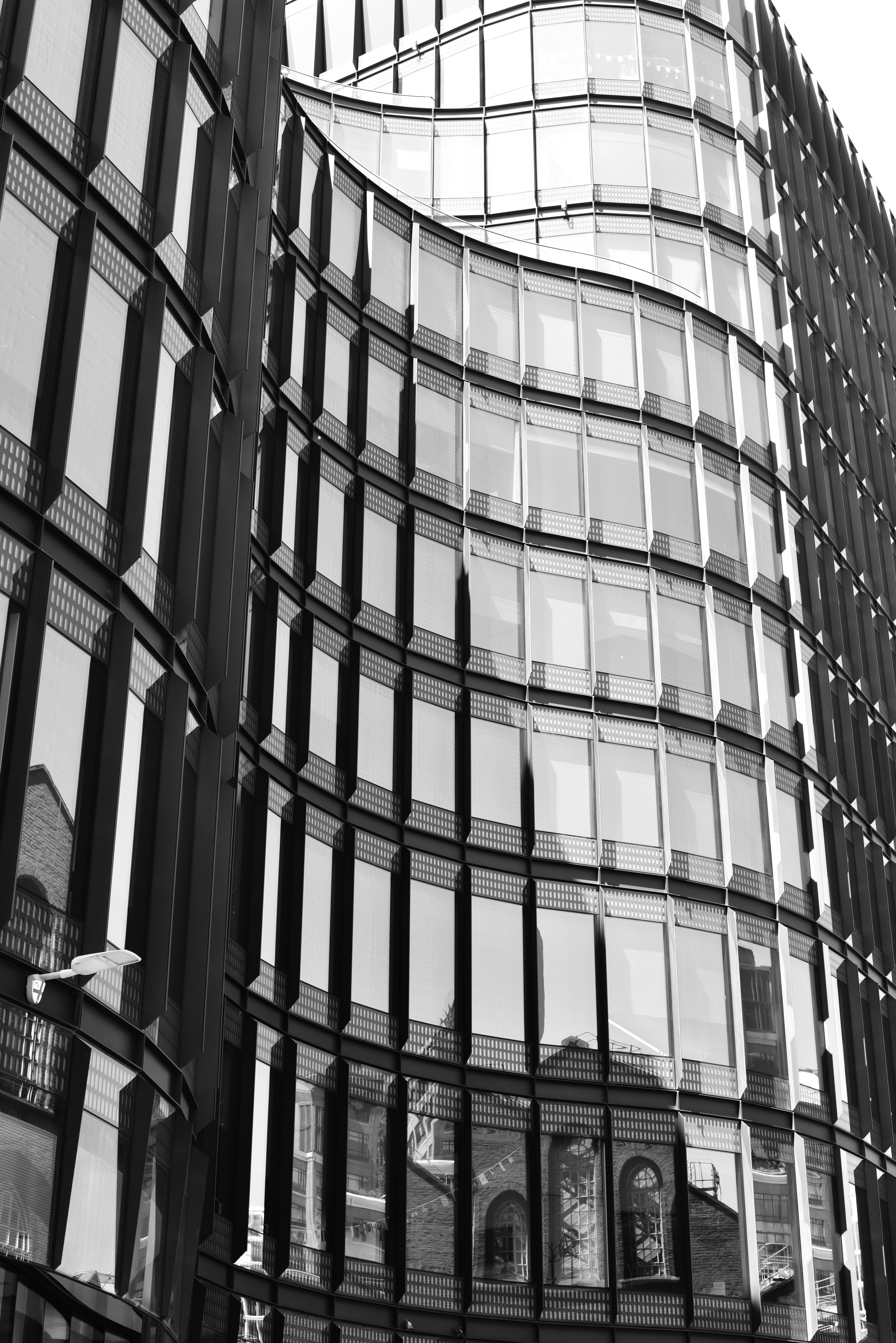 Glass Facade Convergence: A Tilted Symphony of Modern Curves