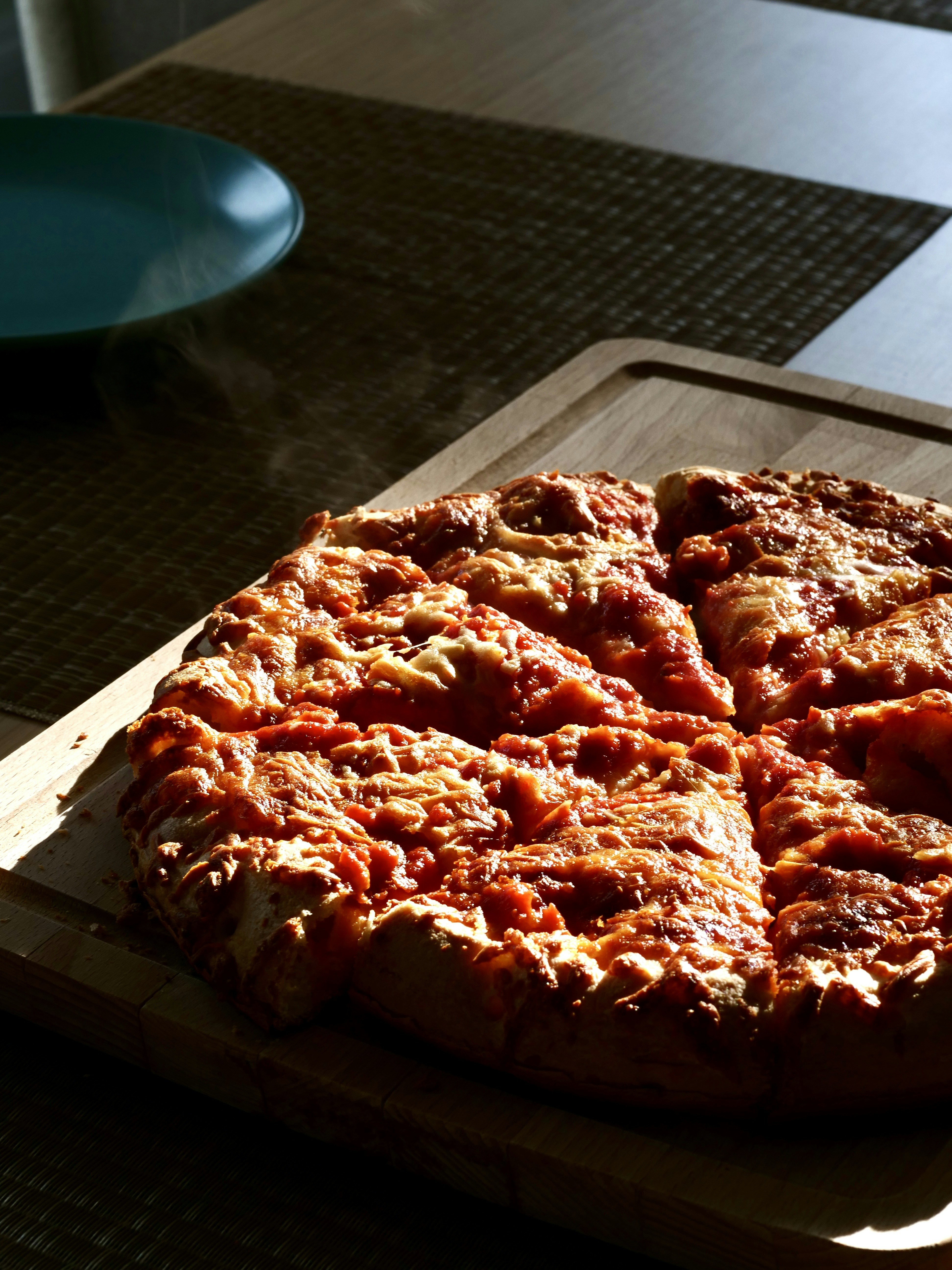 Charred Gourmet: Pizza Slices Rest on a Wooden Board