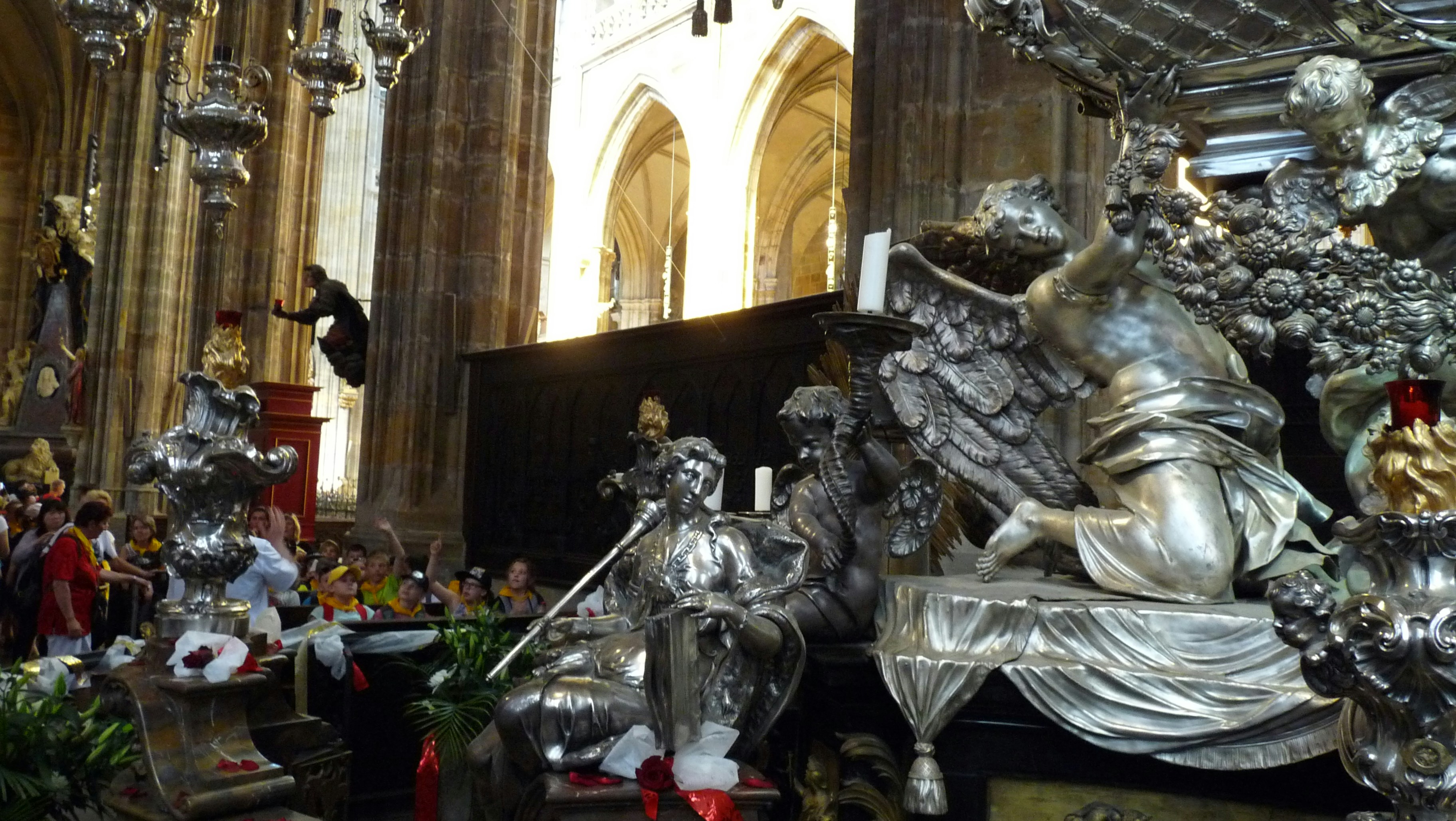 Gilded saints and shadowed Baroque altar at dusk