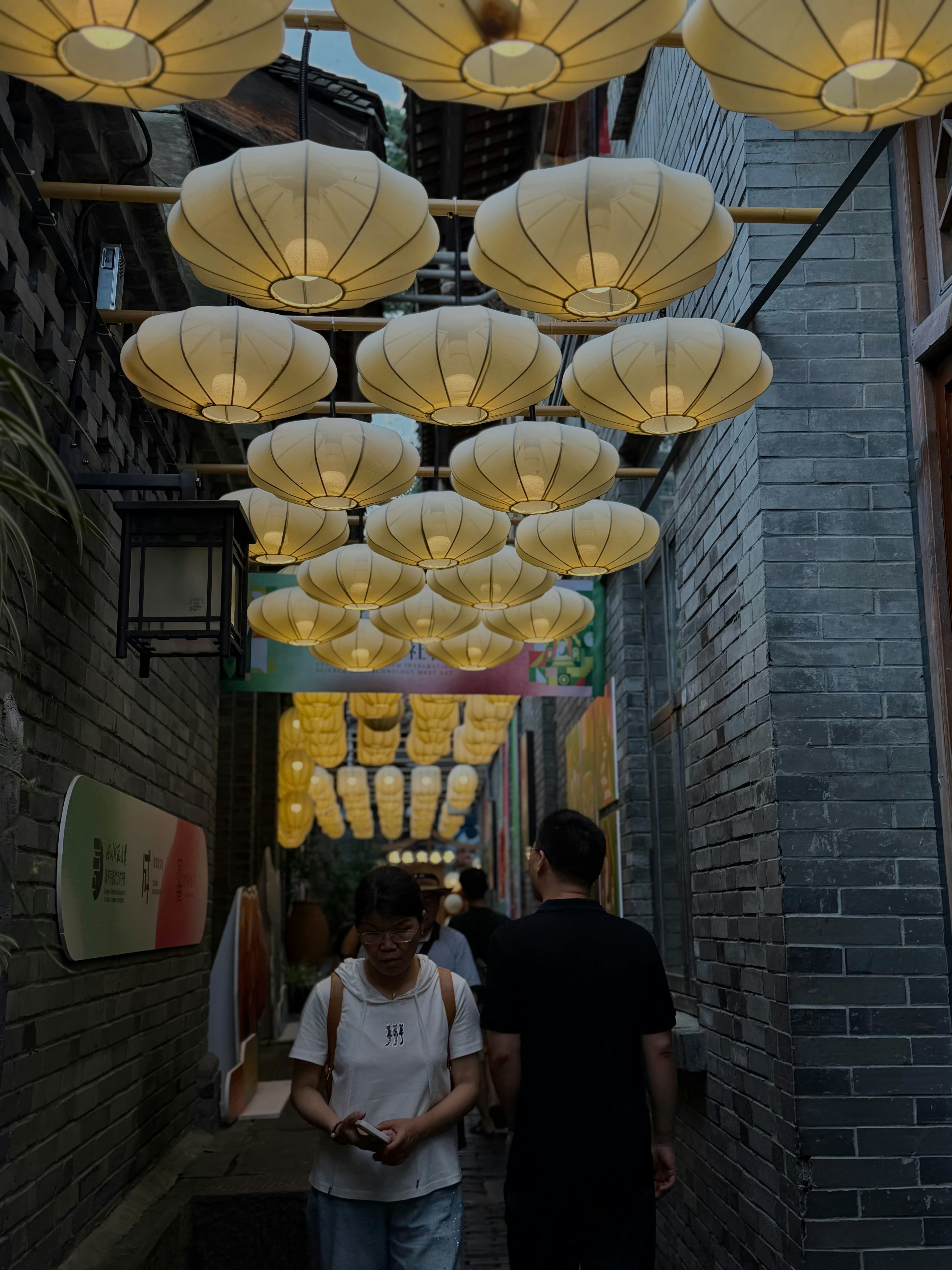 Lantern Corridor: People, Lights, and Narrow Alley