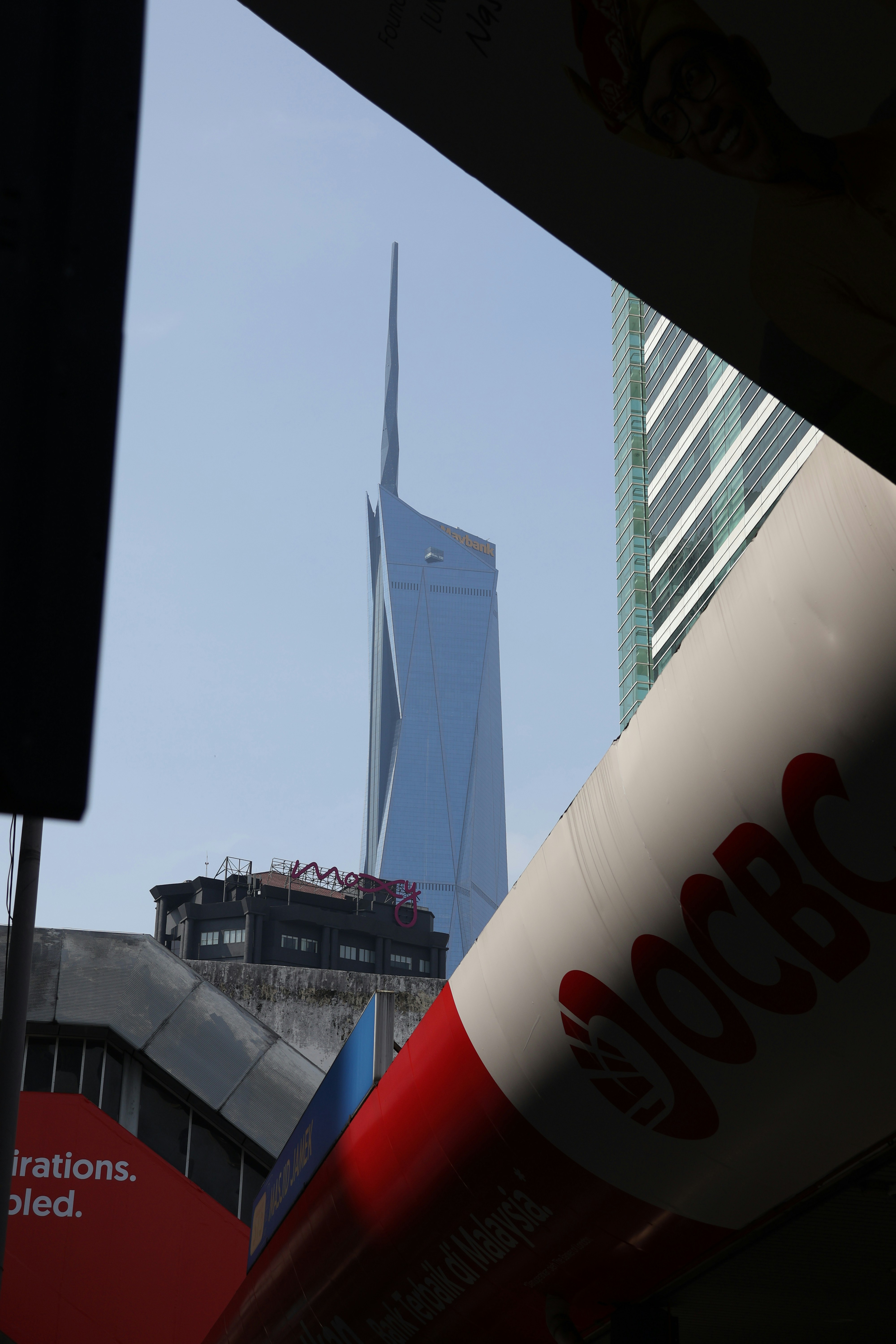 Lofty Needle Amid Street Canopies