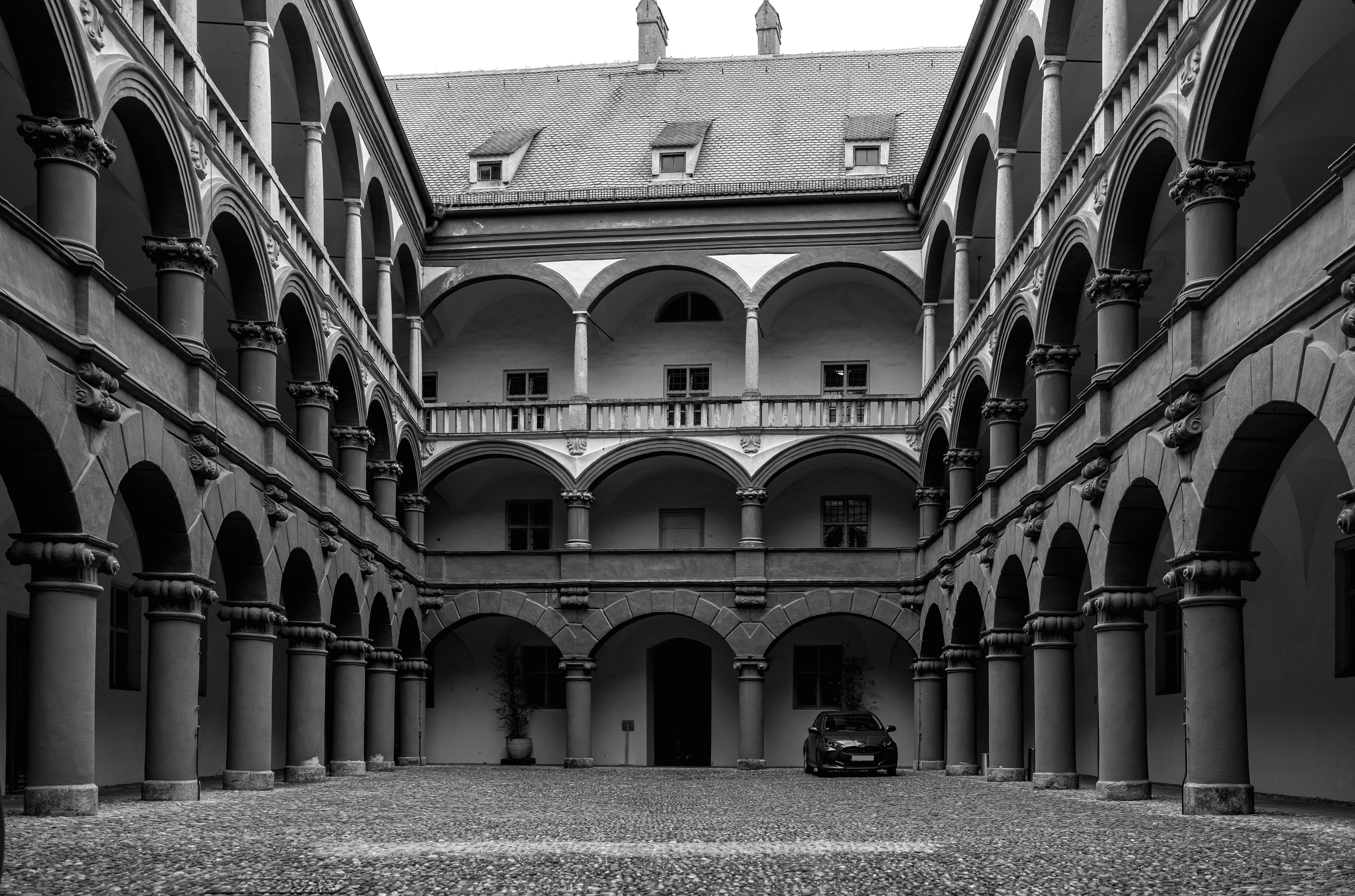 Courtyard of Echoes: Symmetry Under Archways