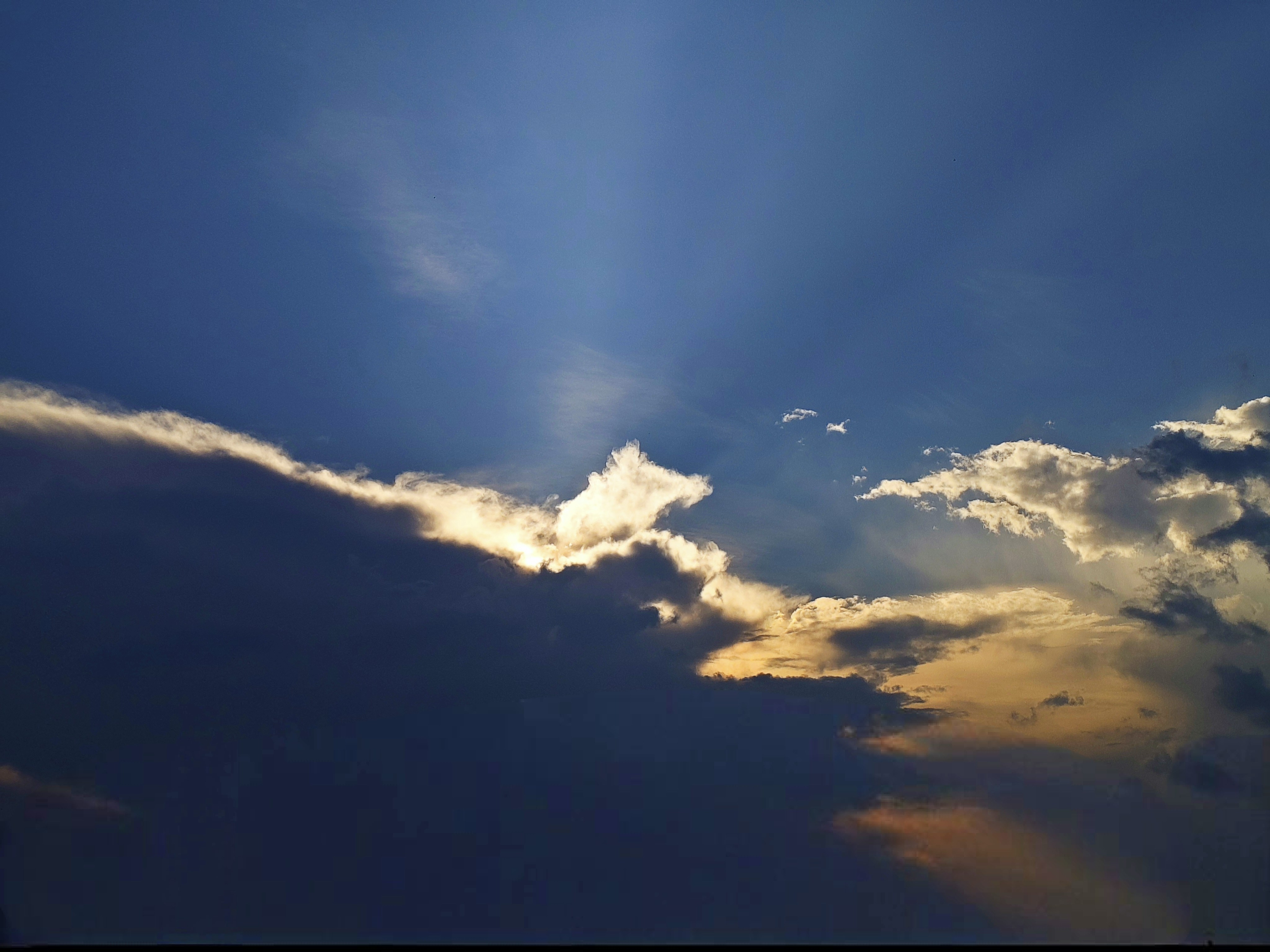 Dawn Break over Distant Clouds