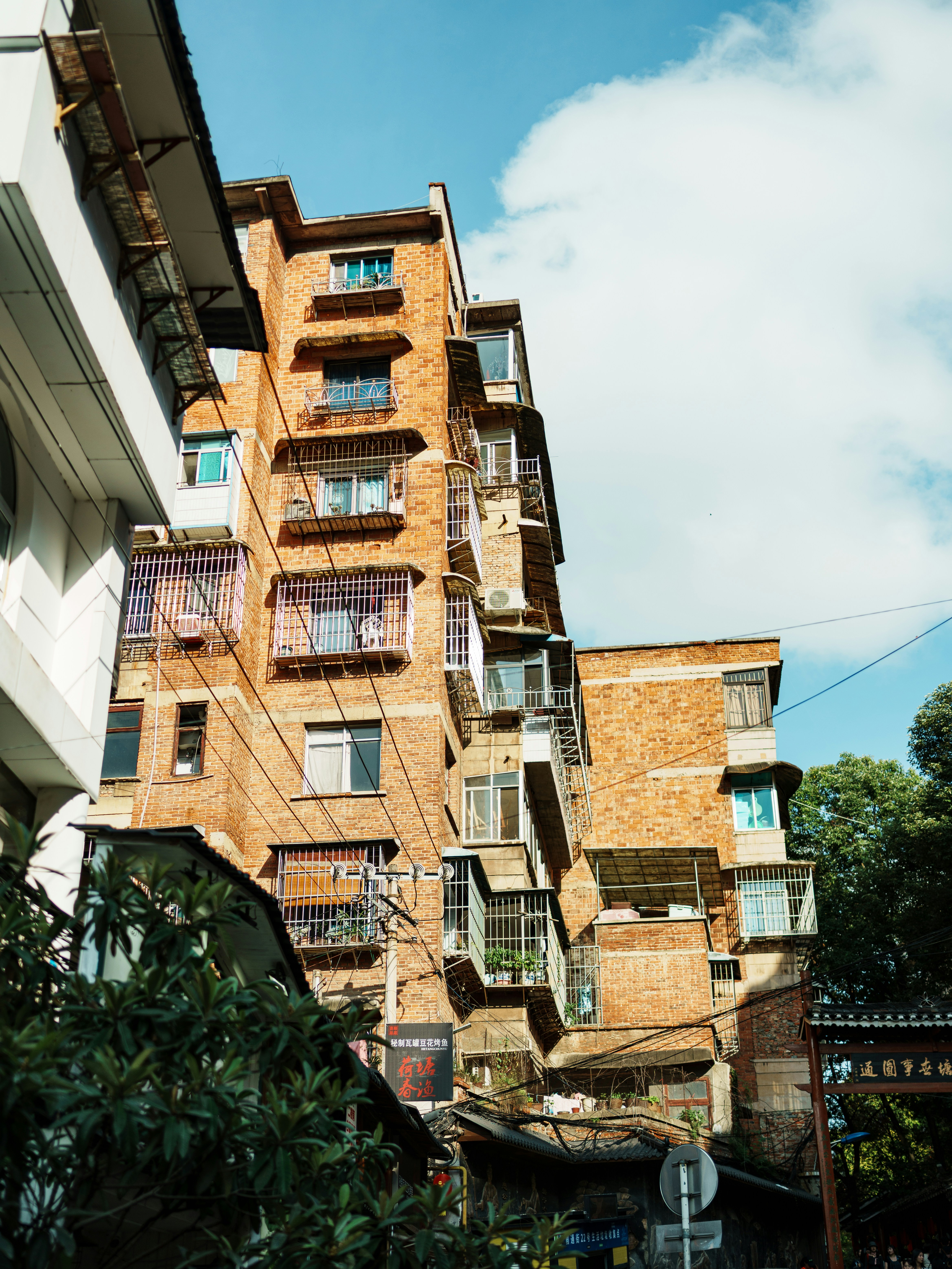 Brick-tiered Residency: An Urban Staircase of Balconies Climbing Skyward