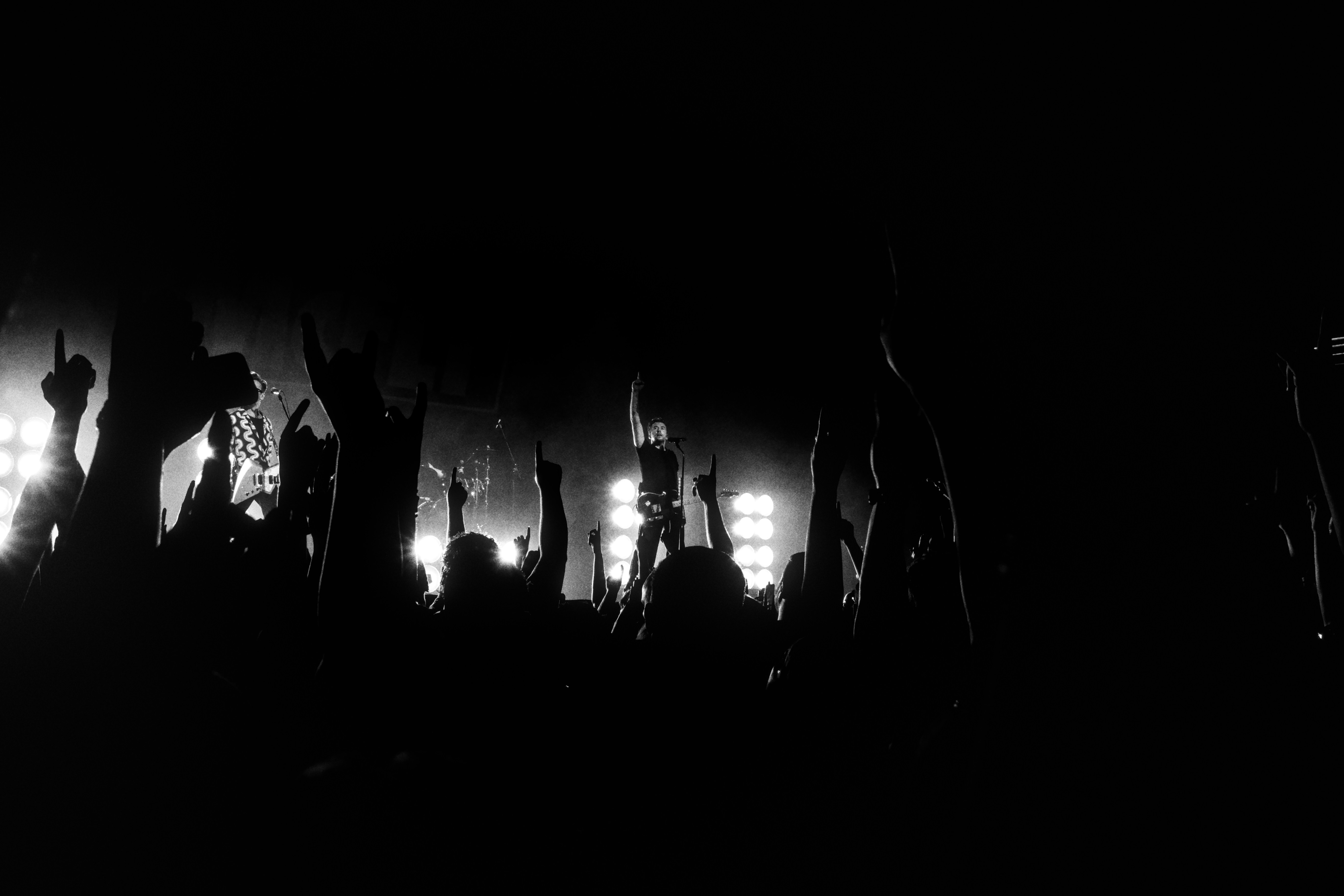 Midnight Echoes: Hands Raised in Silent Anthem