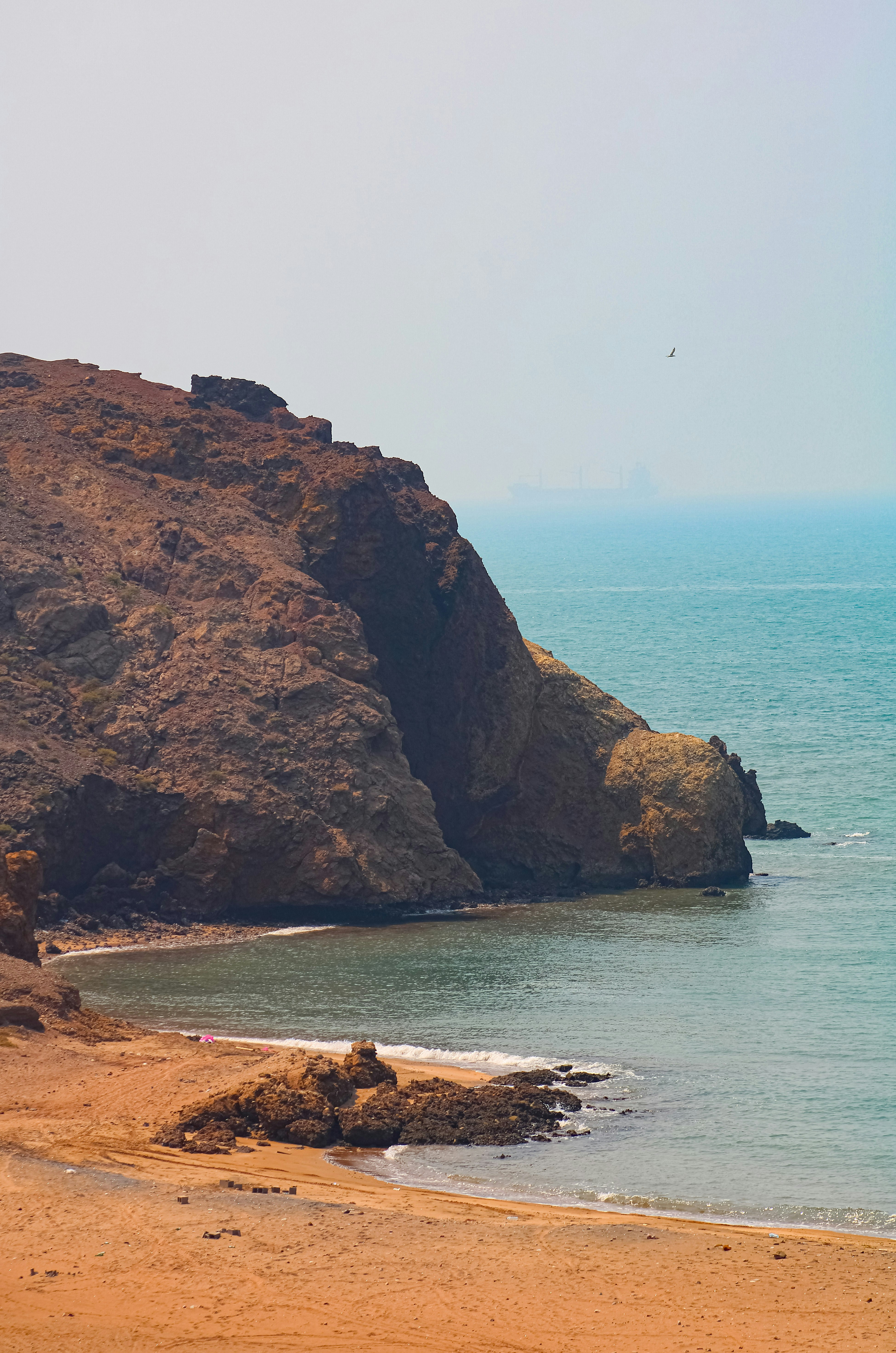 Coastal Cliffs Meeting the Calm Sea at Dusk