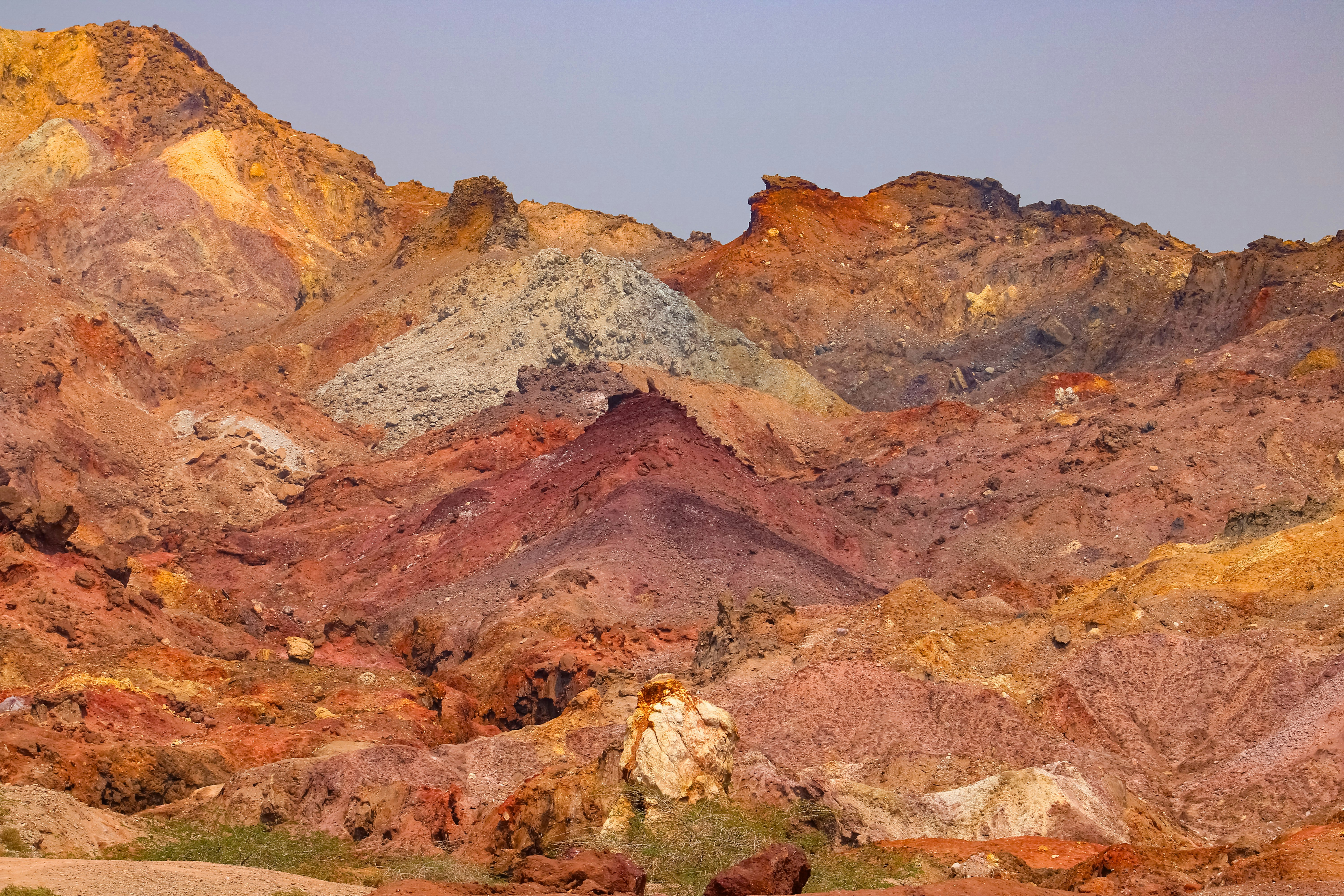 Vermilion Ridge Under a Pale Horizon