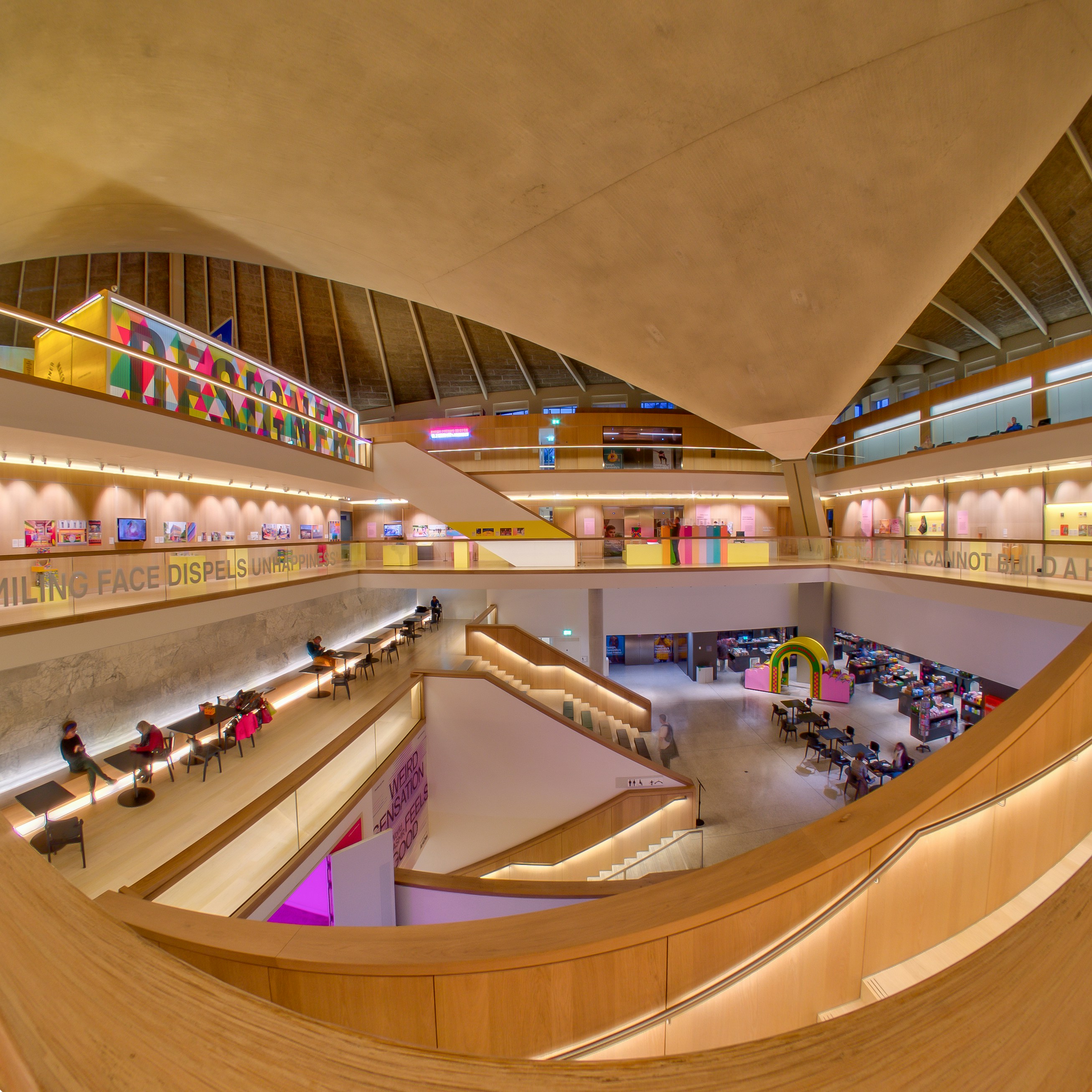 Aidantine Atrium: Multi-Level Light and Curves of a Modern Library Space