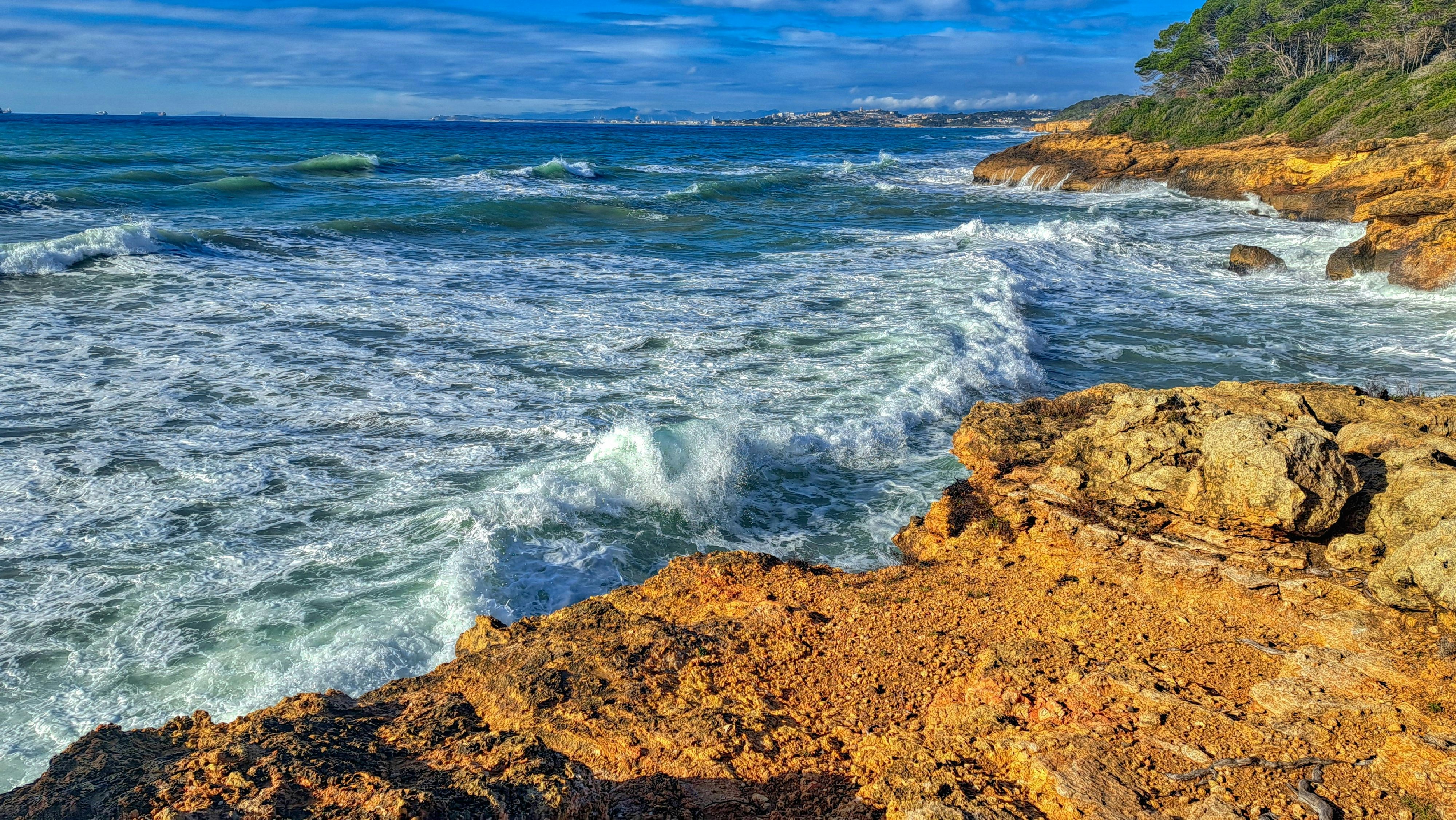 Golden Cliffs Meet Turquoise Surge