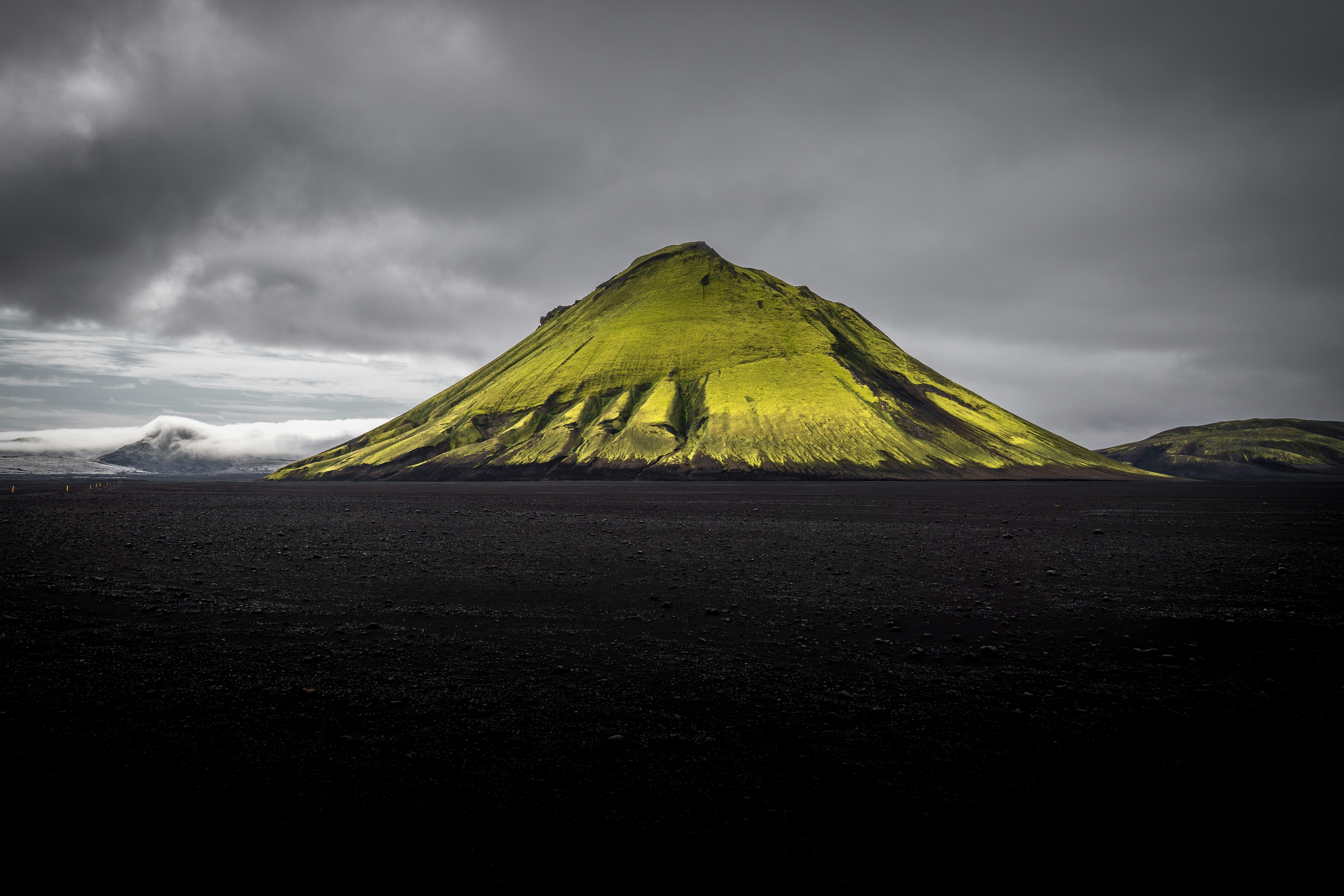 Emerald Peak Against a Stormy Icelandic Plain