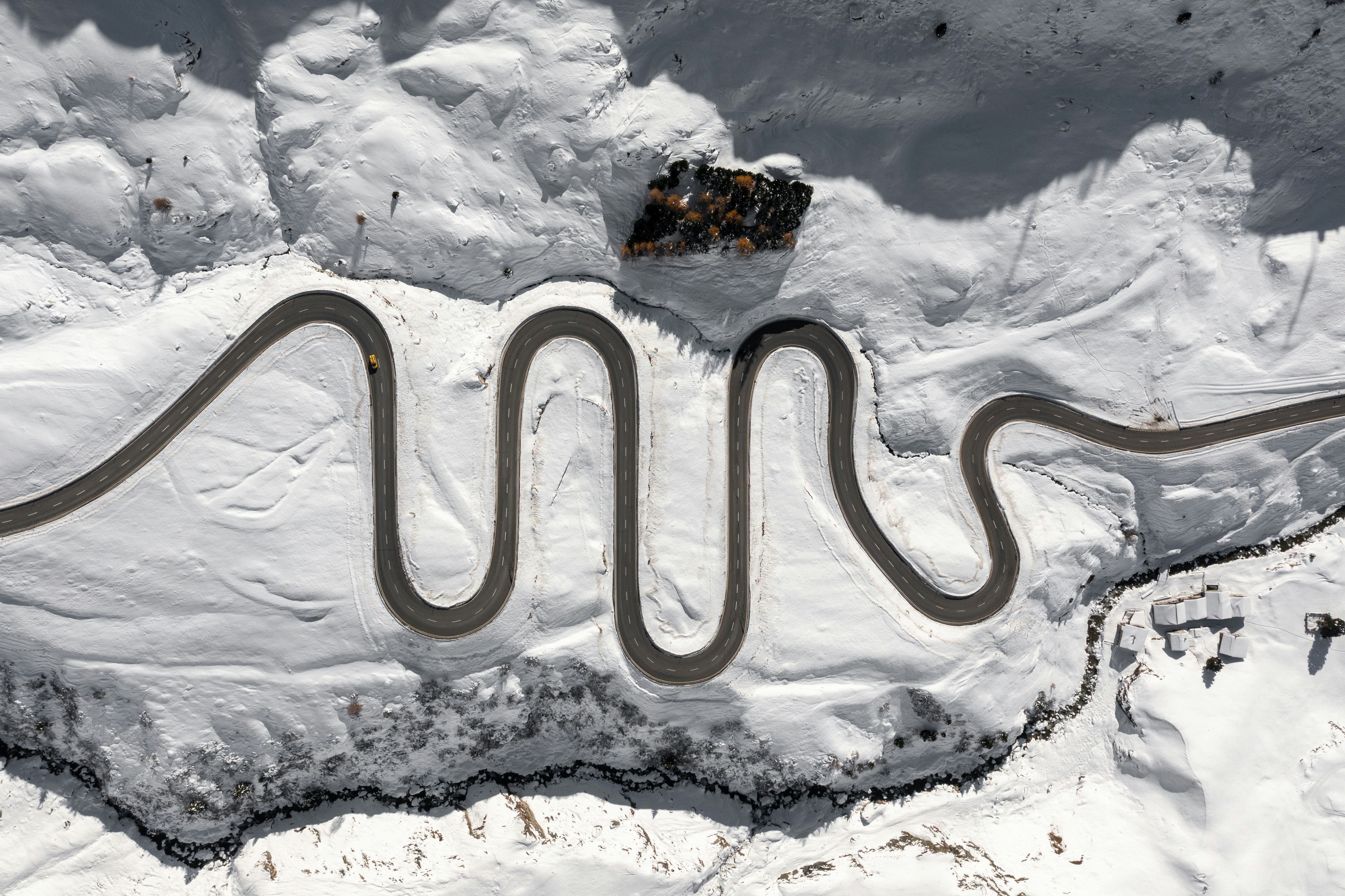 Snowbound Switchbacks: A Coil of Road in White Silence
