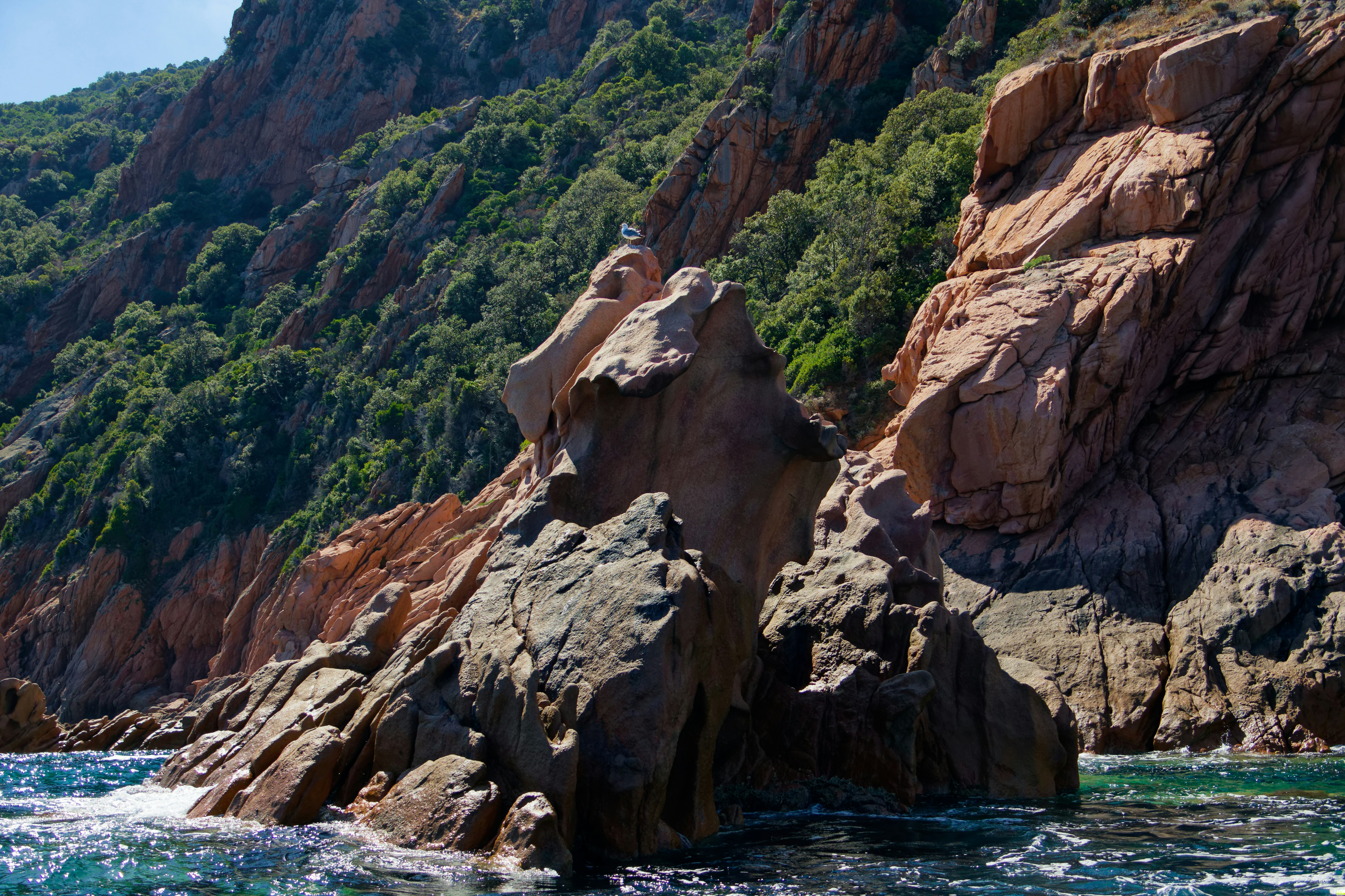 Red cliffscape kissing the blue Mediterranean