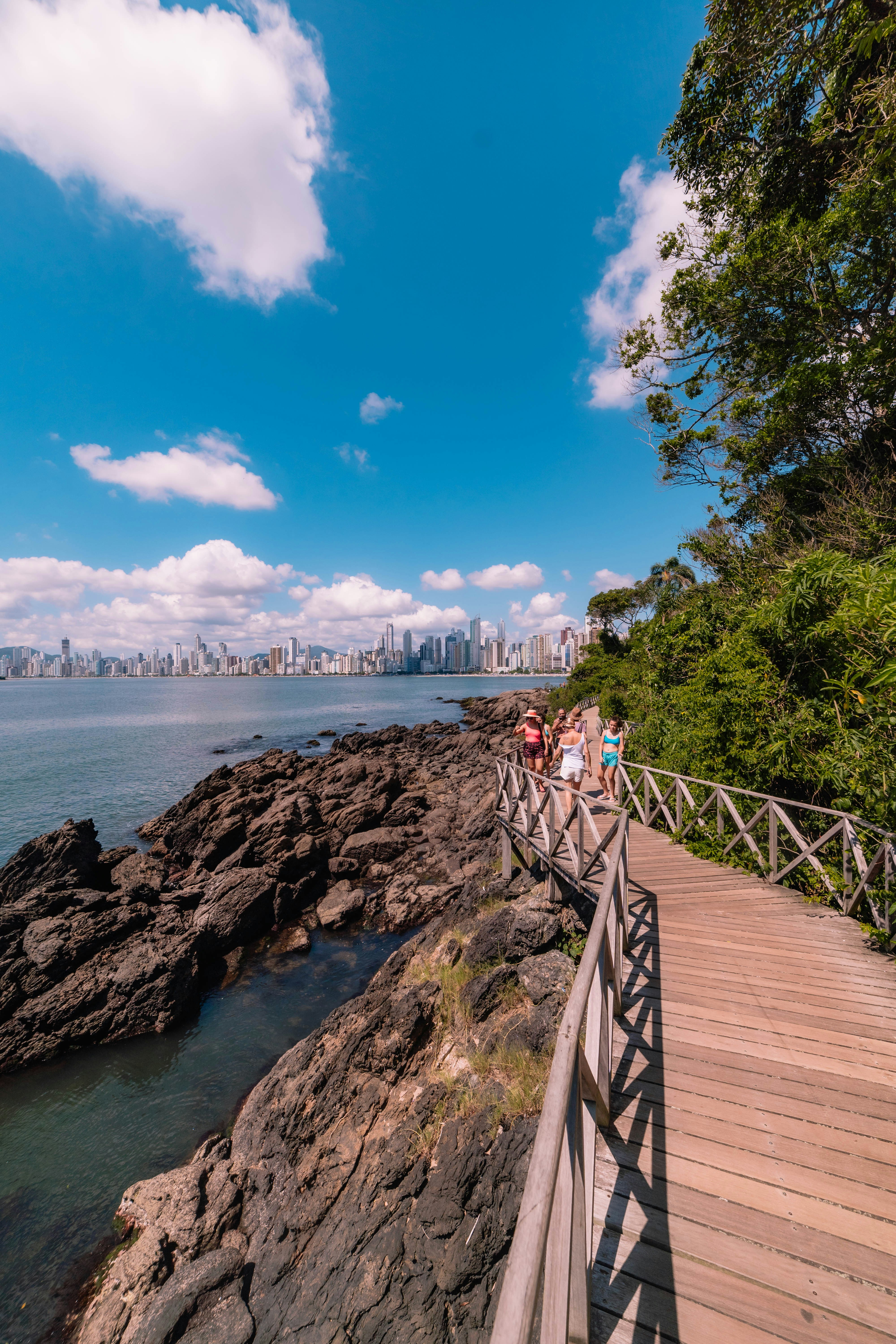 Ridgewalk on the Coastal Promenade: City Silhouette Beyond the Shore