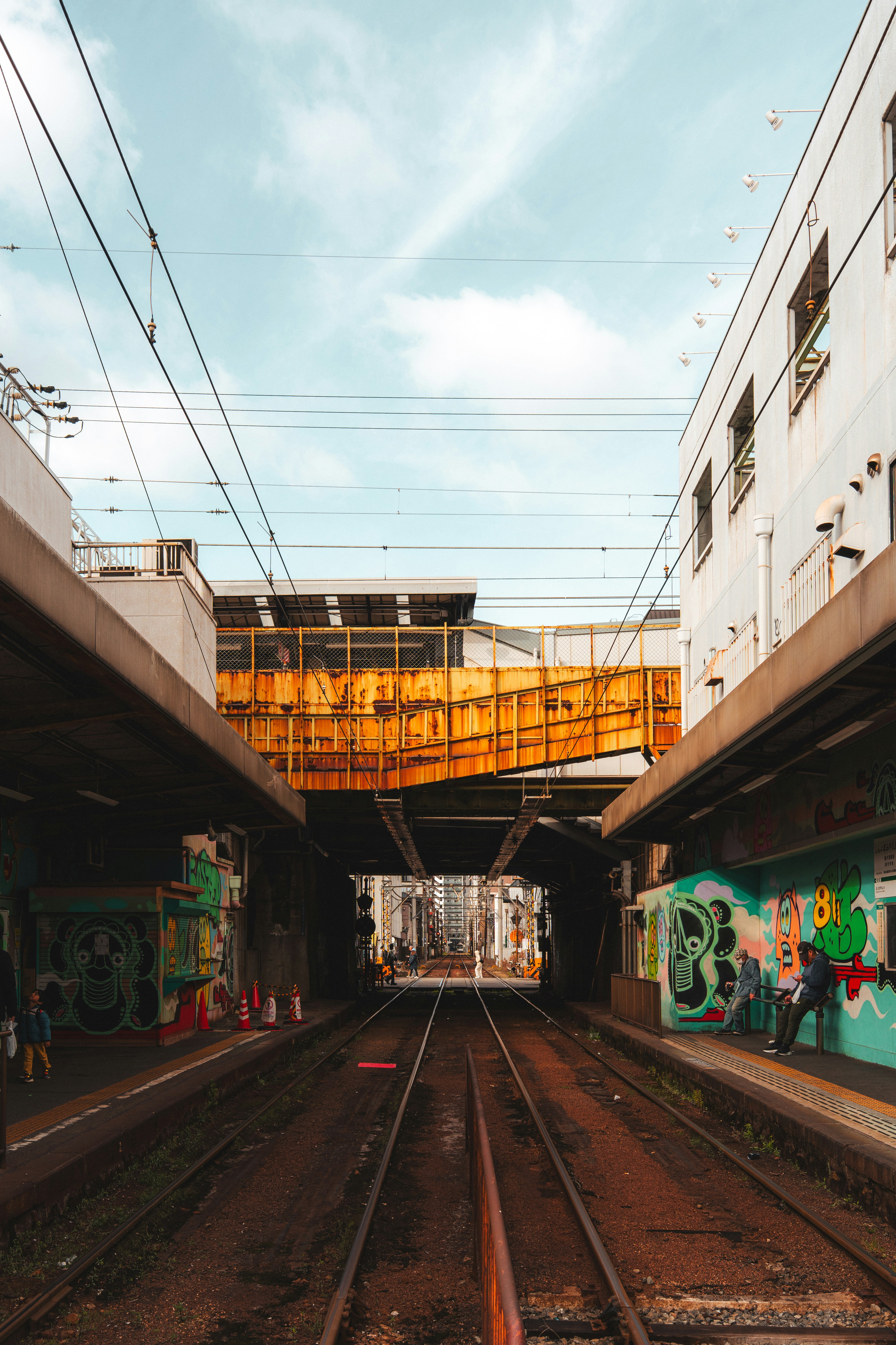 Rails Through the City: A Sunset Walk Under the Overpass