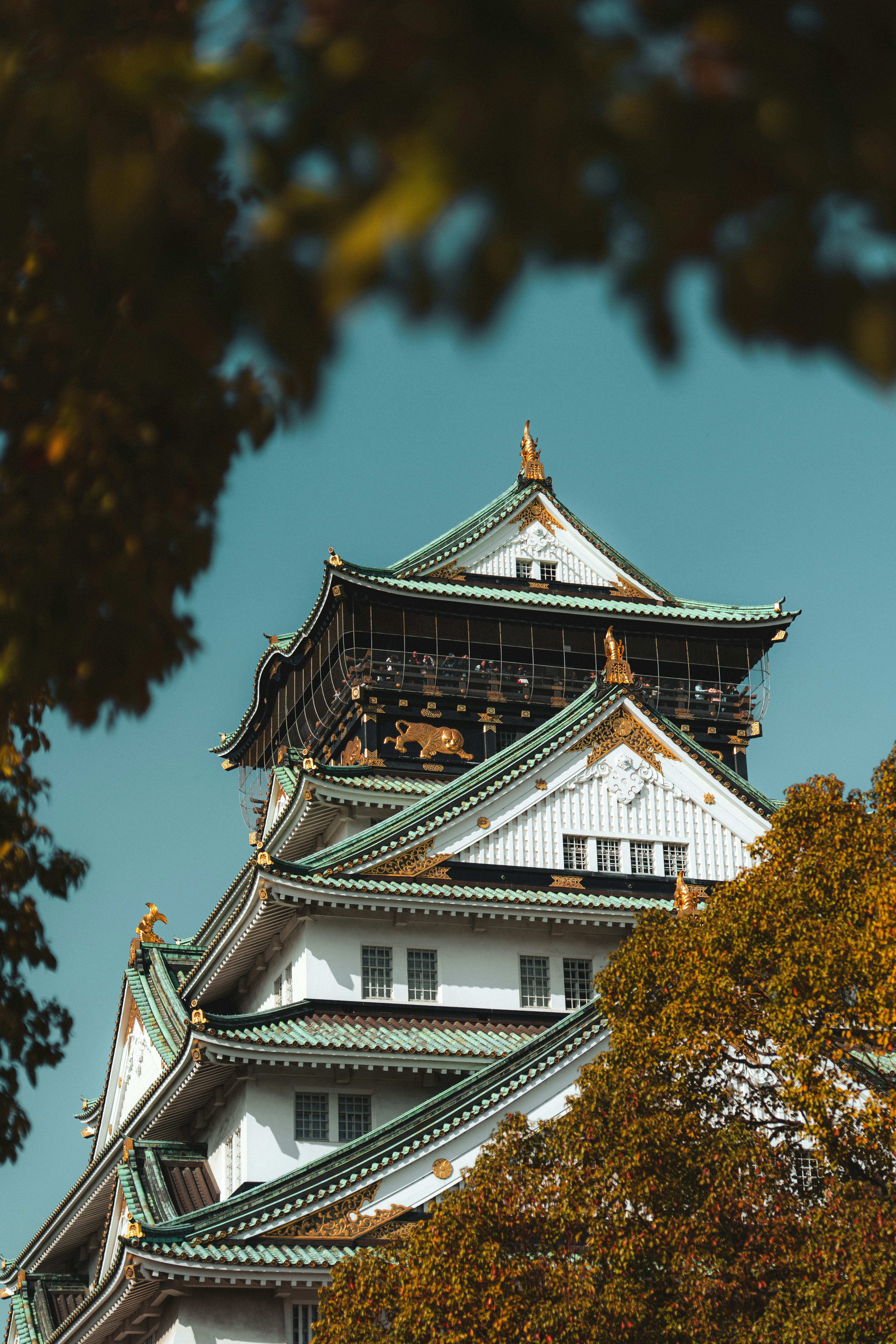 Layered Temple Peaks Above Autumn Foliage
