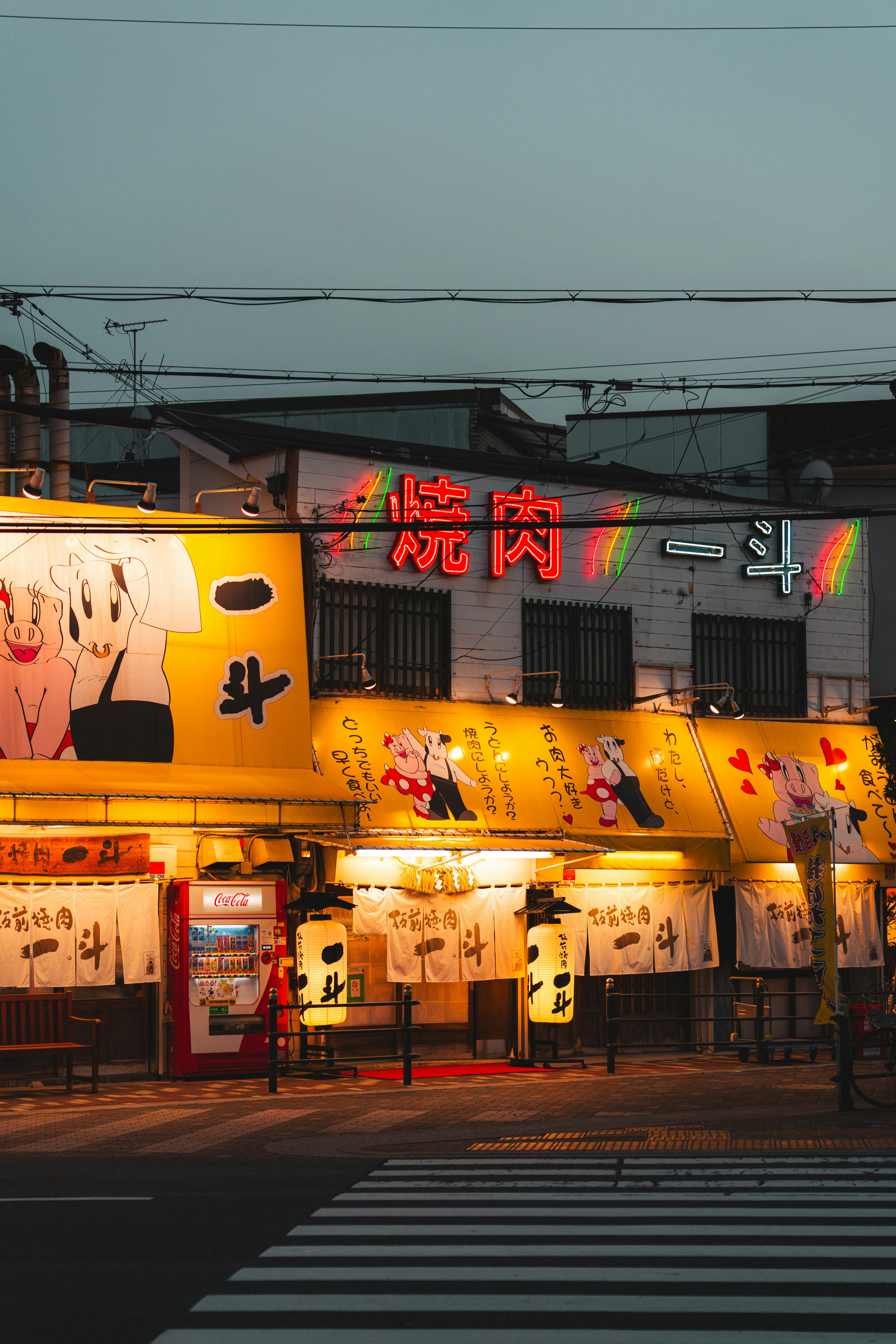 Neon Signage and Golden Facade: Night Market Front in Tokyo Alley