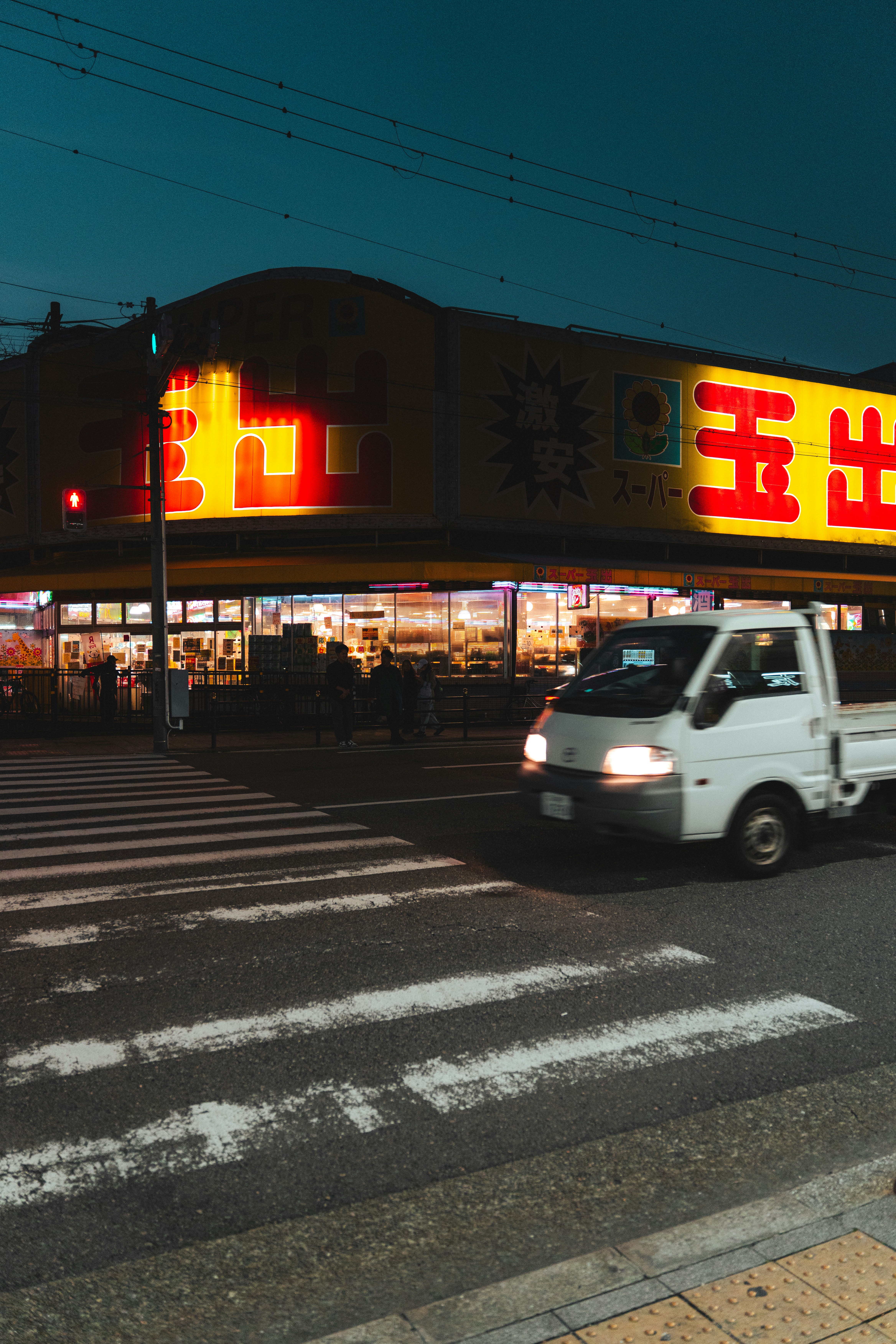 Neon Facade at Dusk: A Busy Street Corner